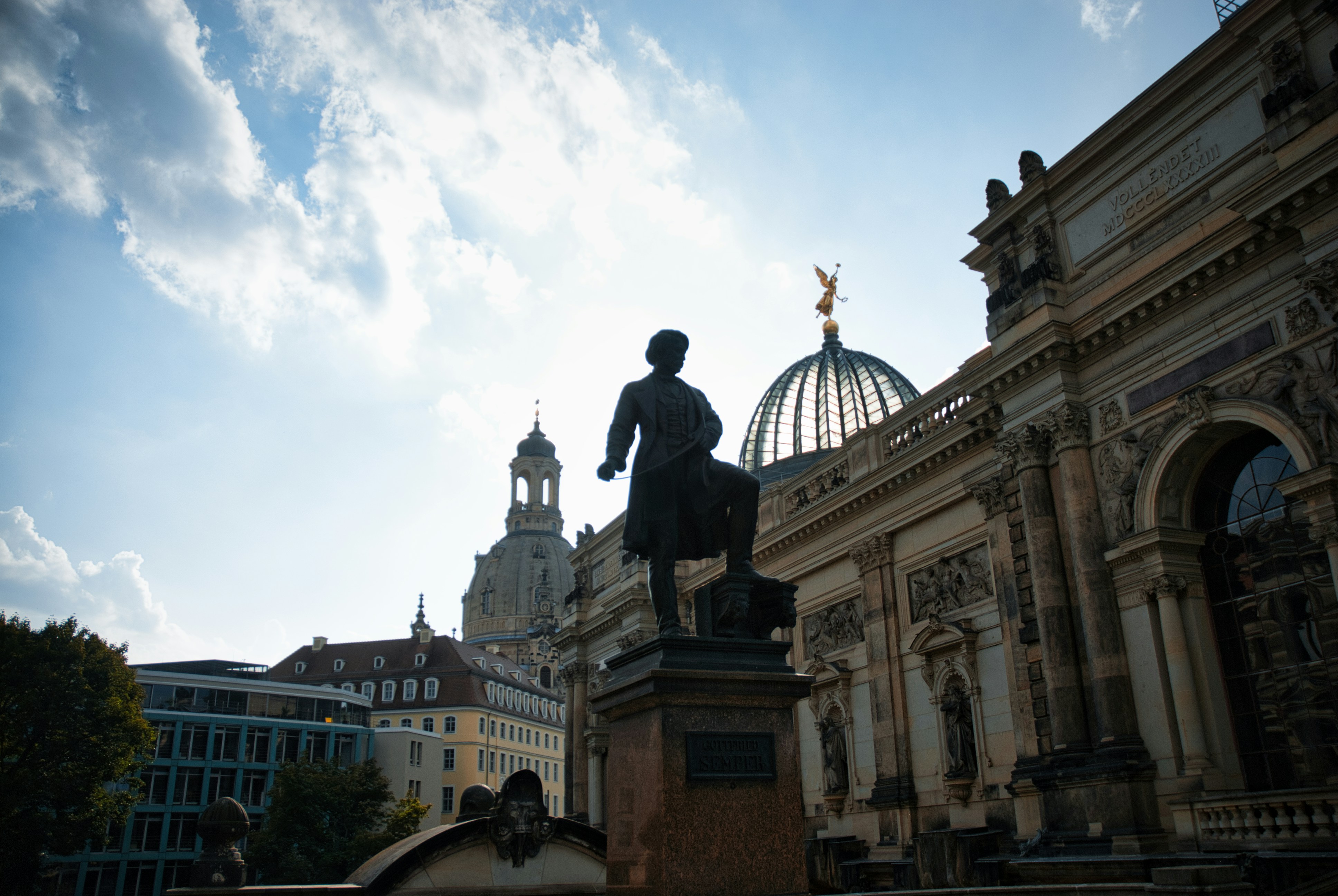 Bronze Sentinel Before a Glass-Domed Neoclassical Facade
