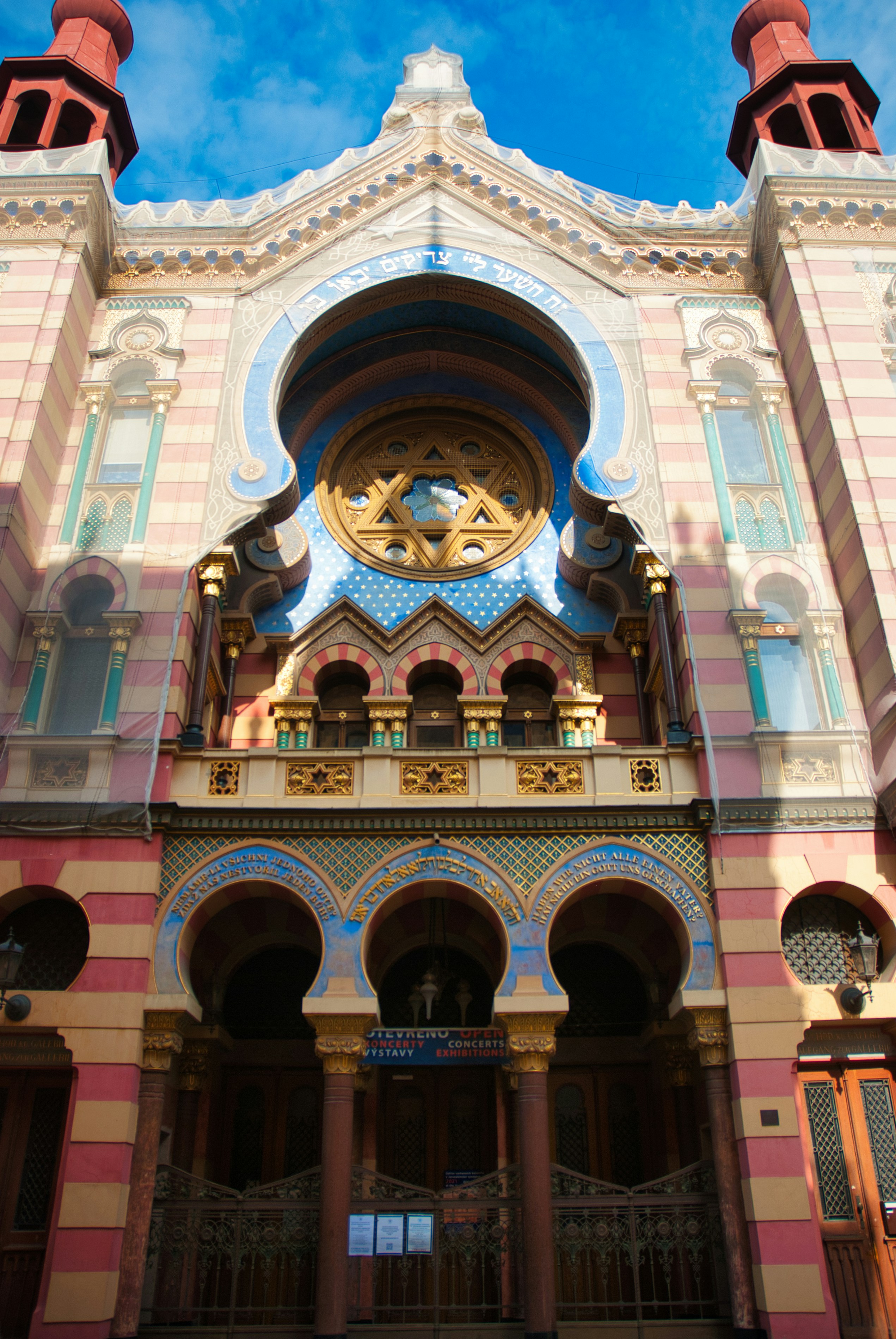 Ornate facade of a historic synagogue with colorful details.