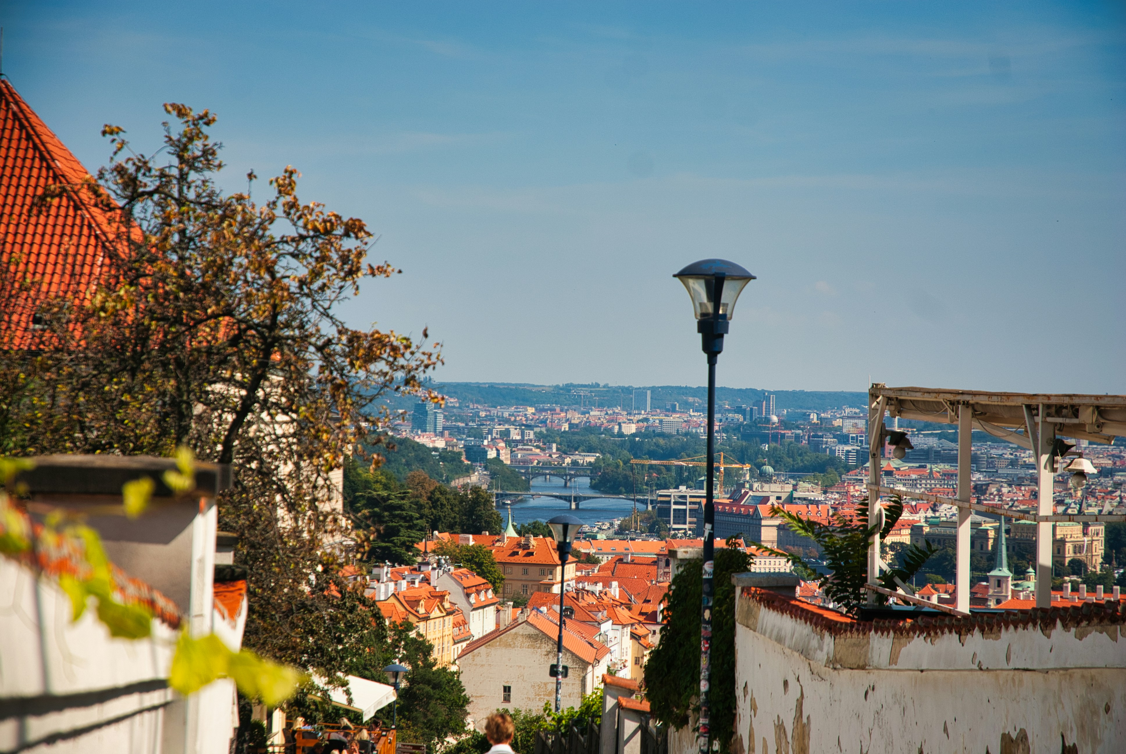 View of a european city with a river and rooftops.