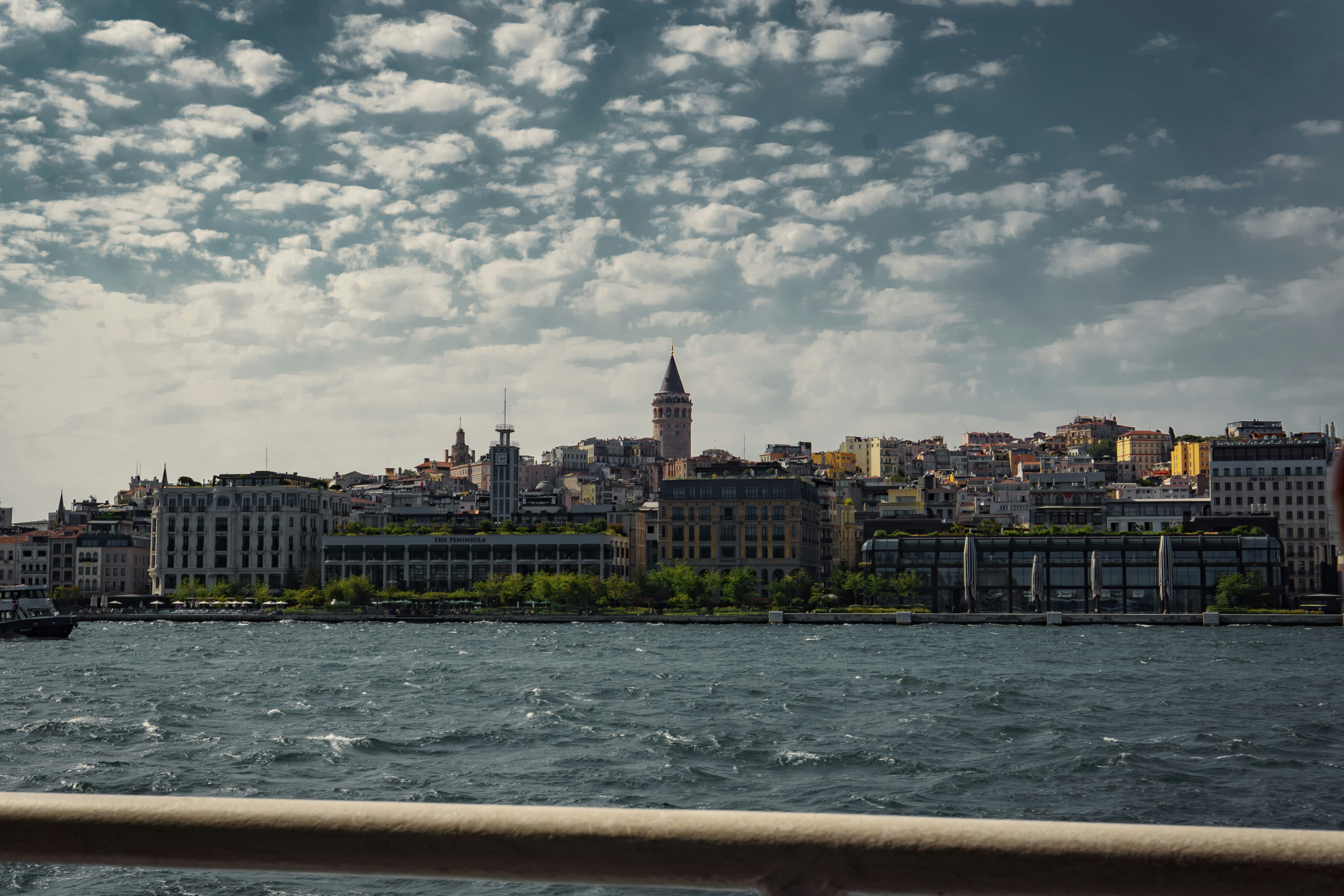 Galata from bosphorus ferry | City skyline with a prominent tower by the water