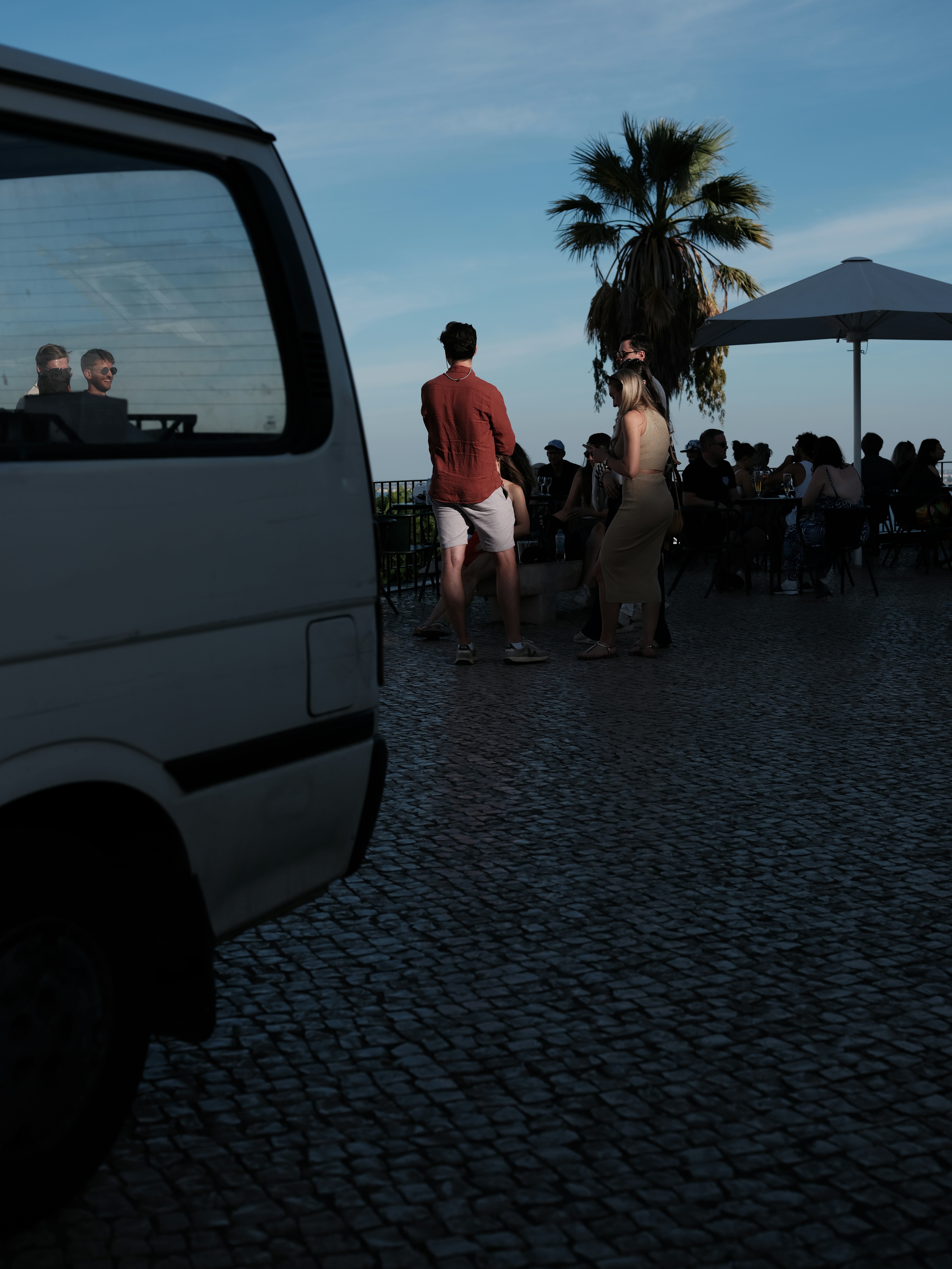 Evening Revelry Amidst Urban Shadows