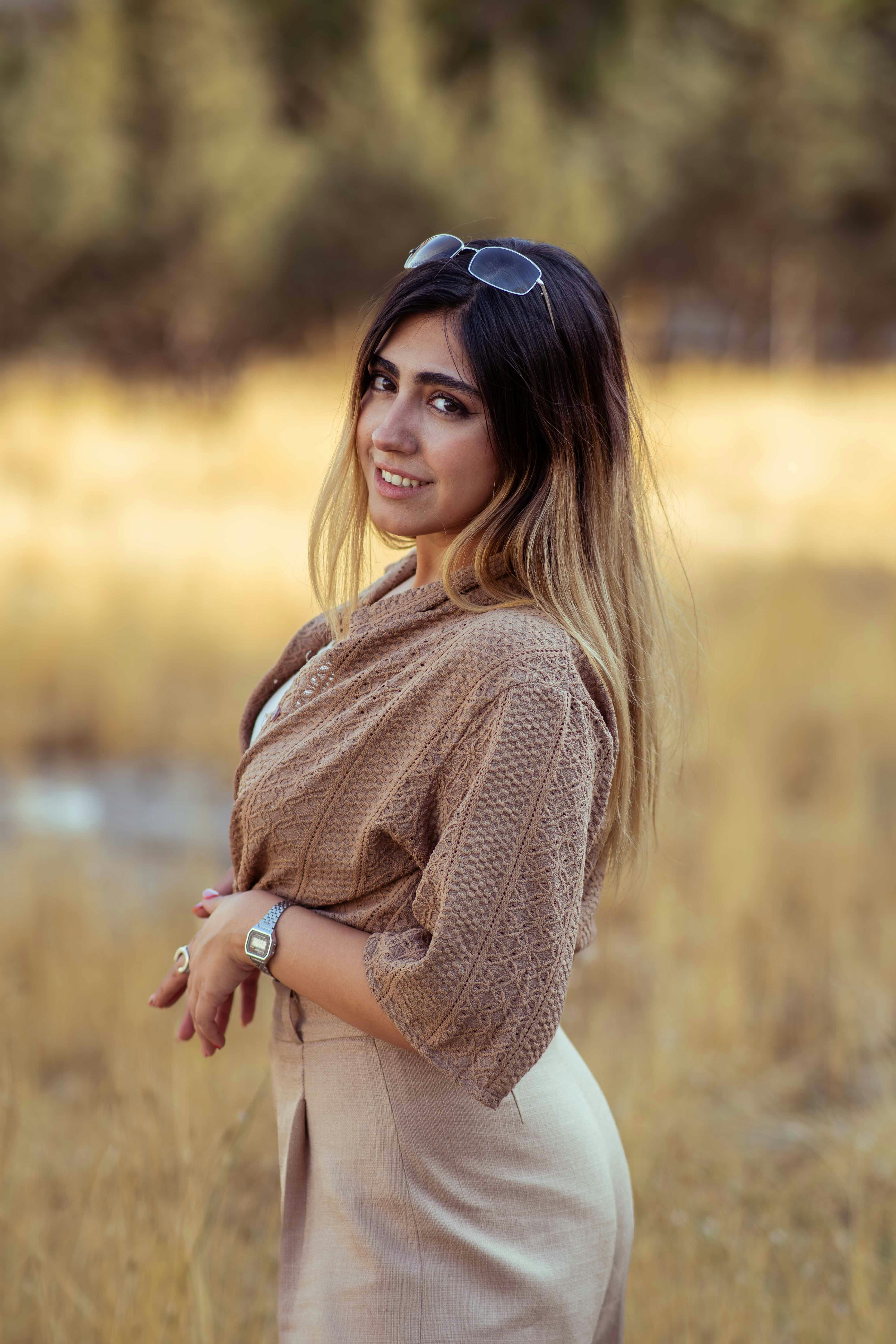 Young woman smiling in a field