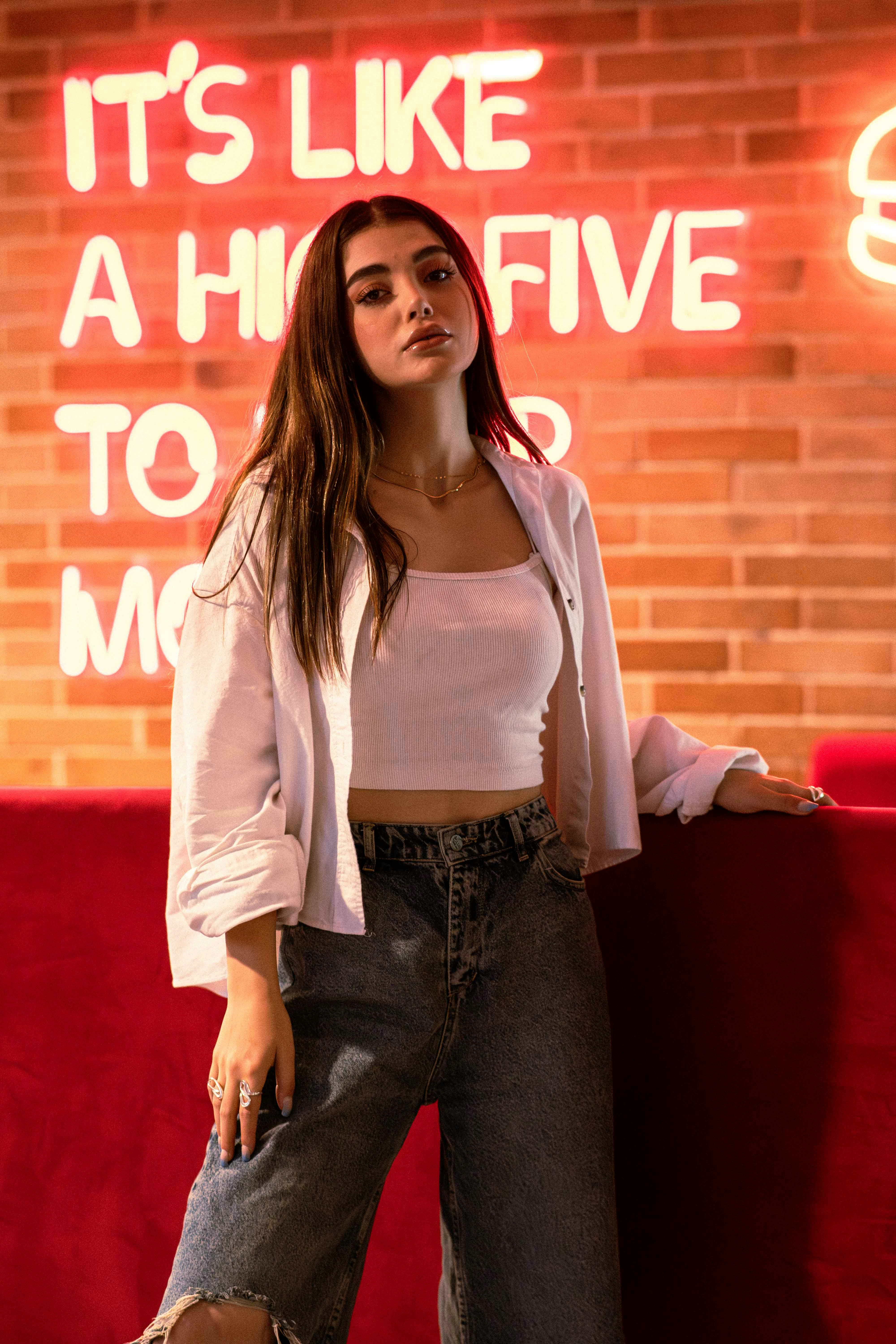 Neon Glow and Quiet Confidence in a Brick Backdrop