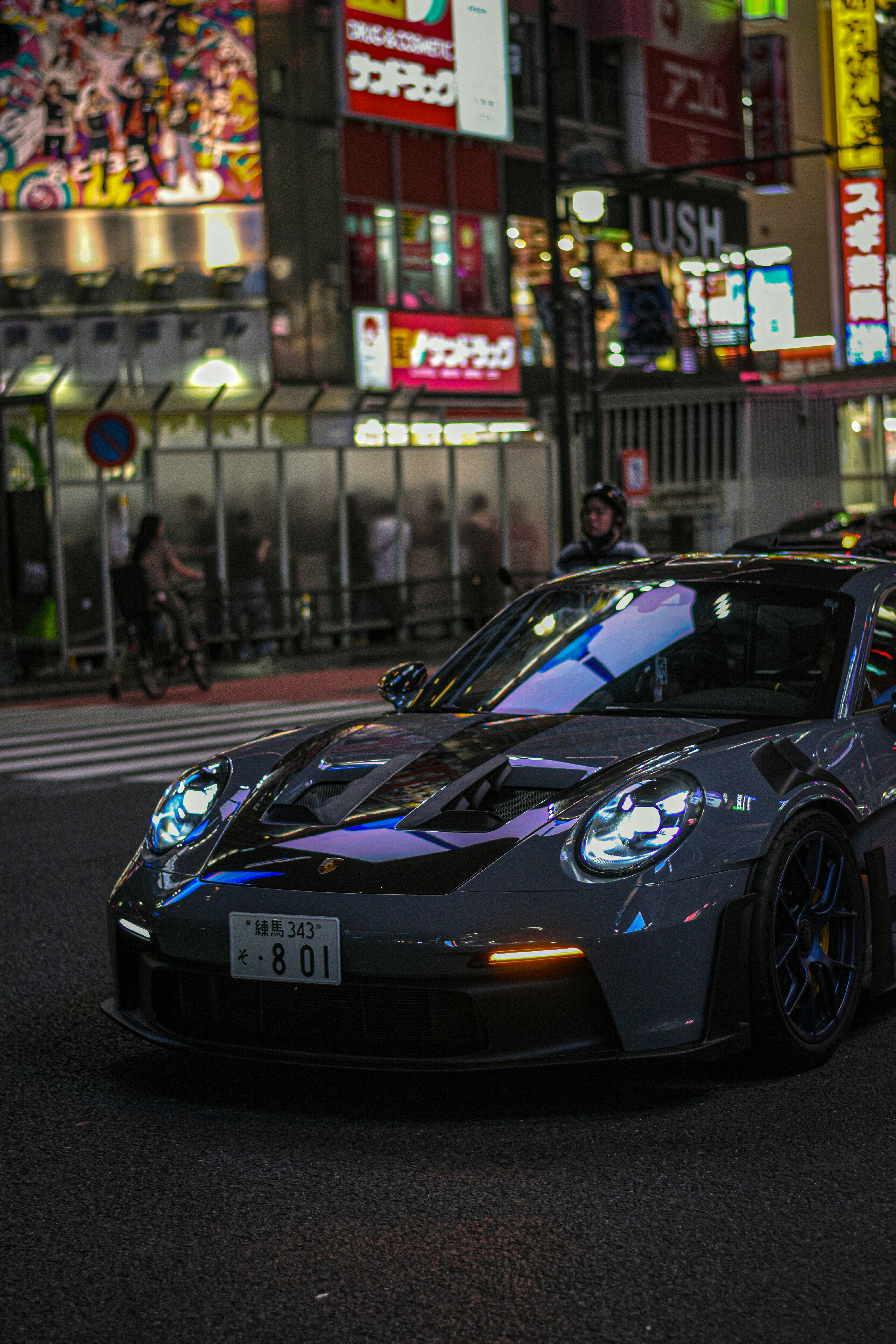 Urban Velocity: A Porsche in Neon Dreams
