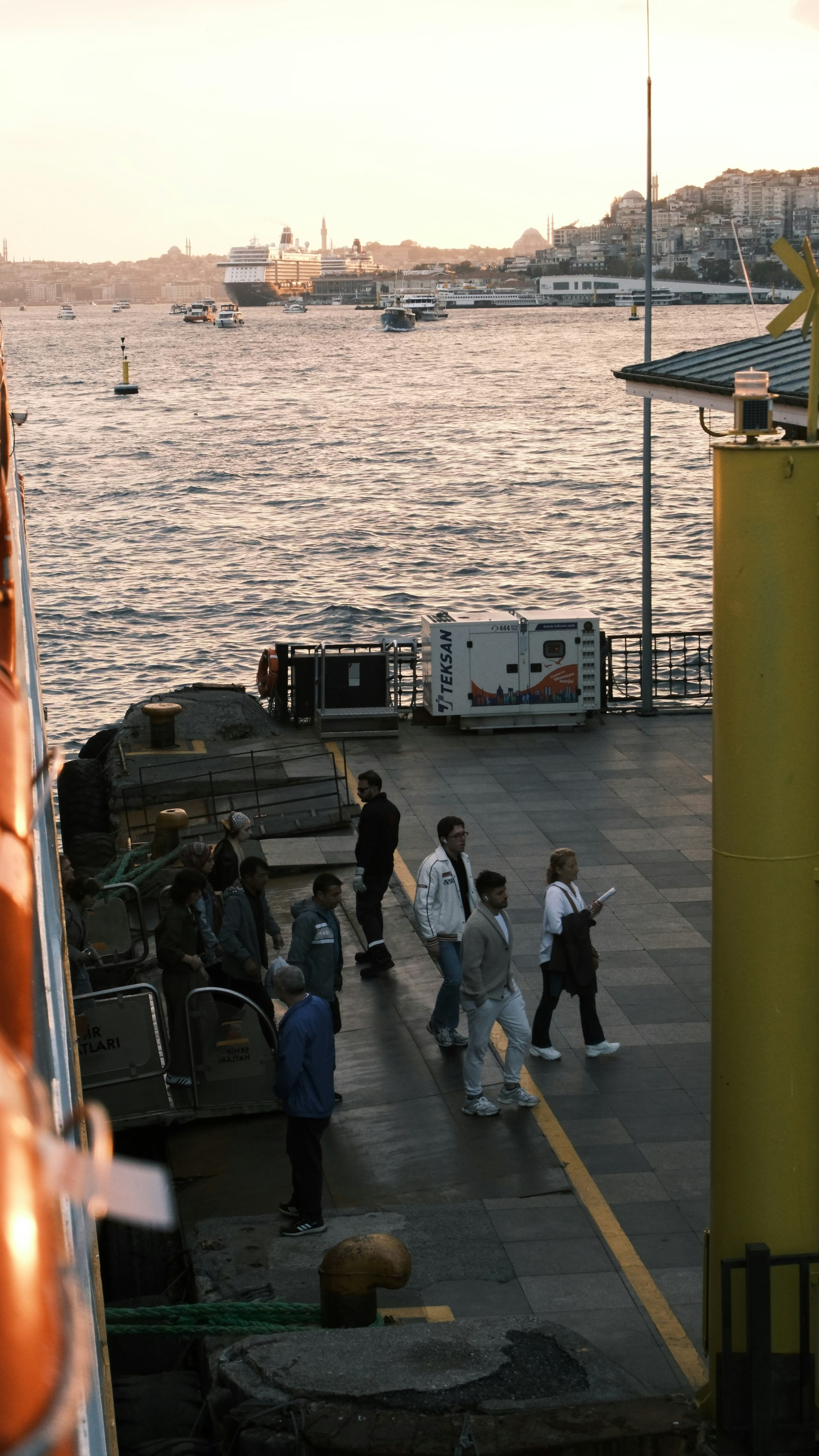 People waiting on a ferry dock with cityscape background photo – Free ...