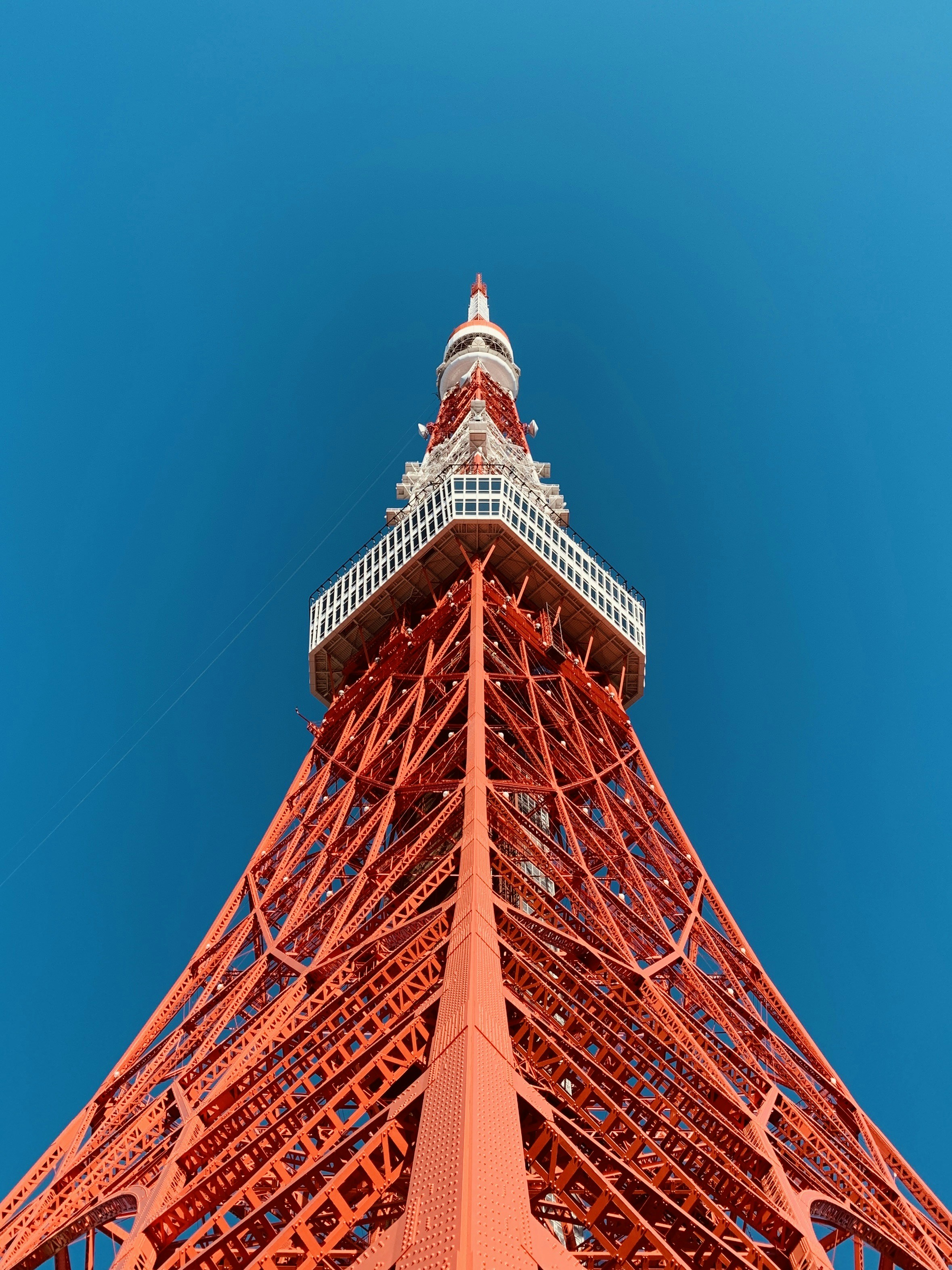 Red tower structure against a clear blue sky