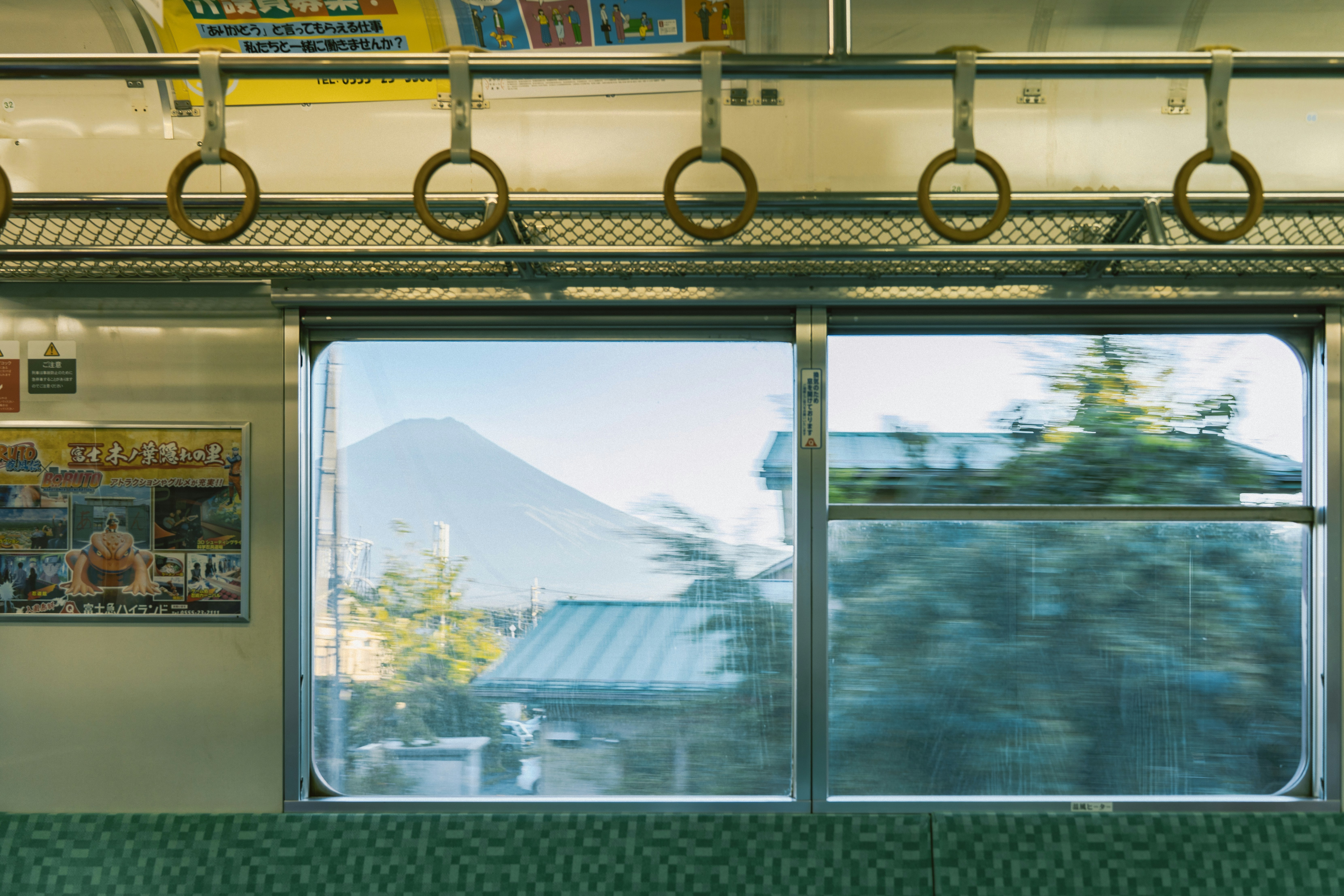 View of mount fuji from a moving train window.