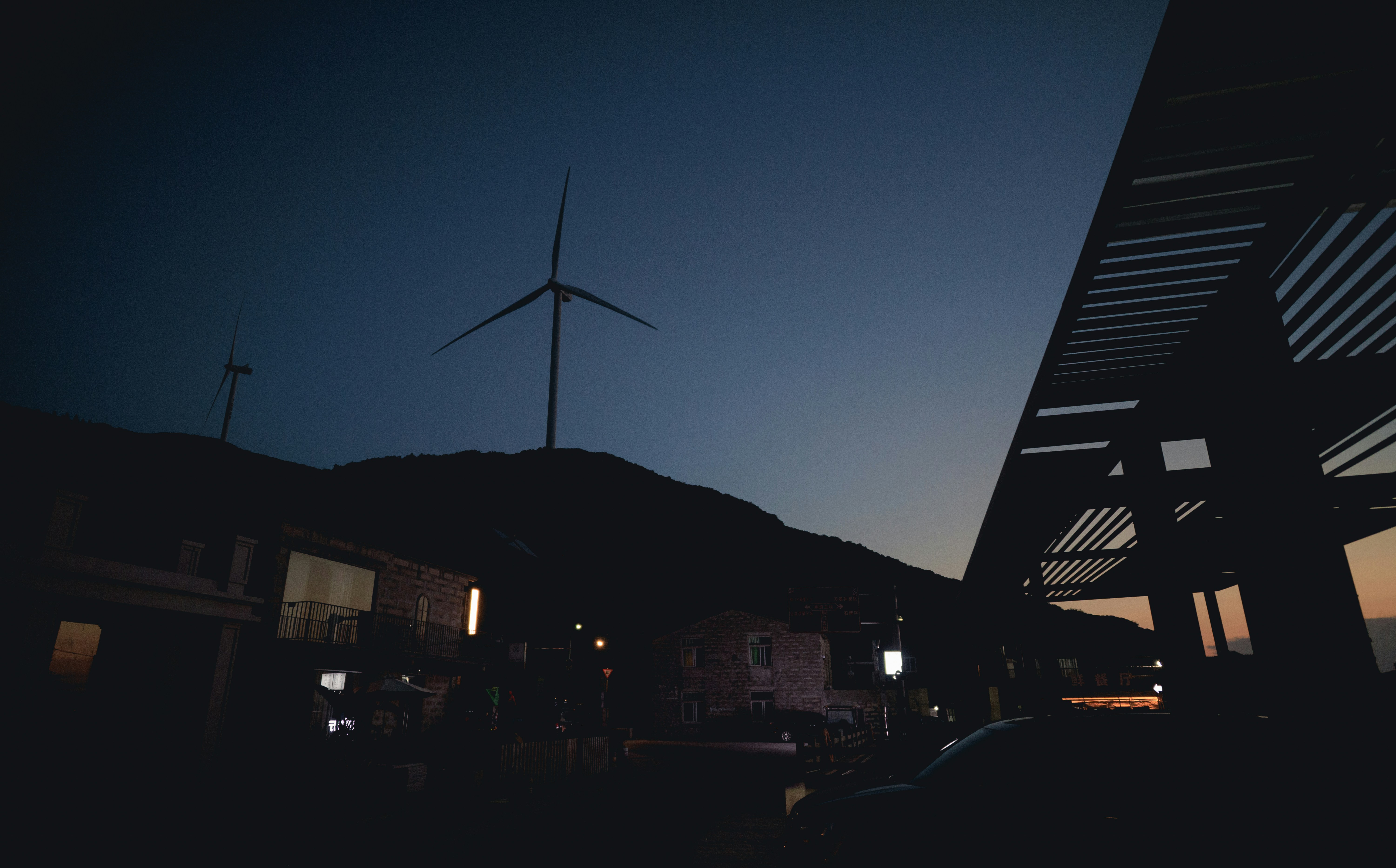Whispered Dusk Over a Hilltop Wind Turbine