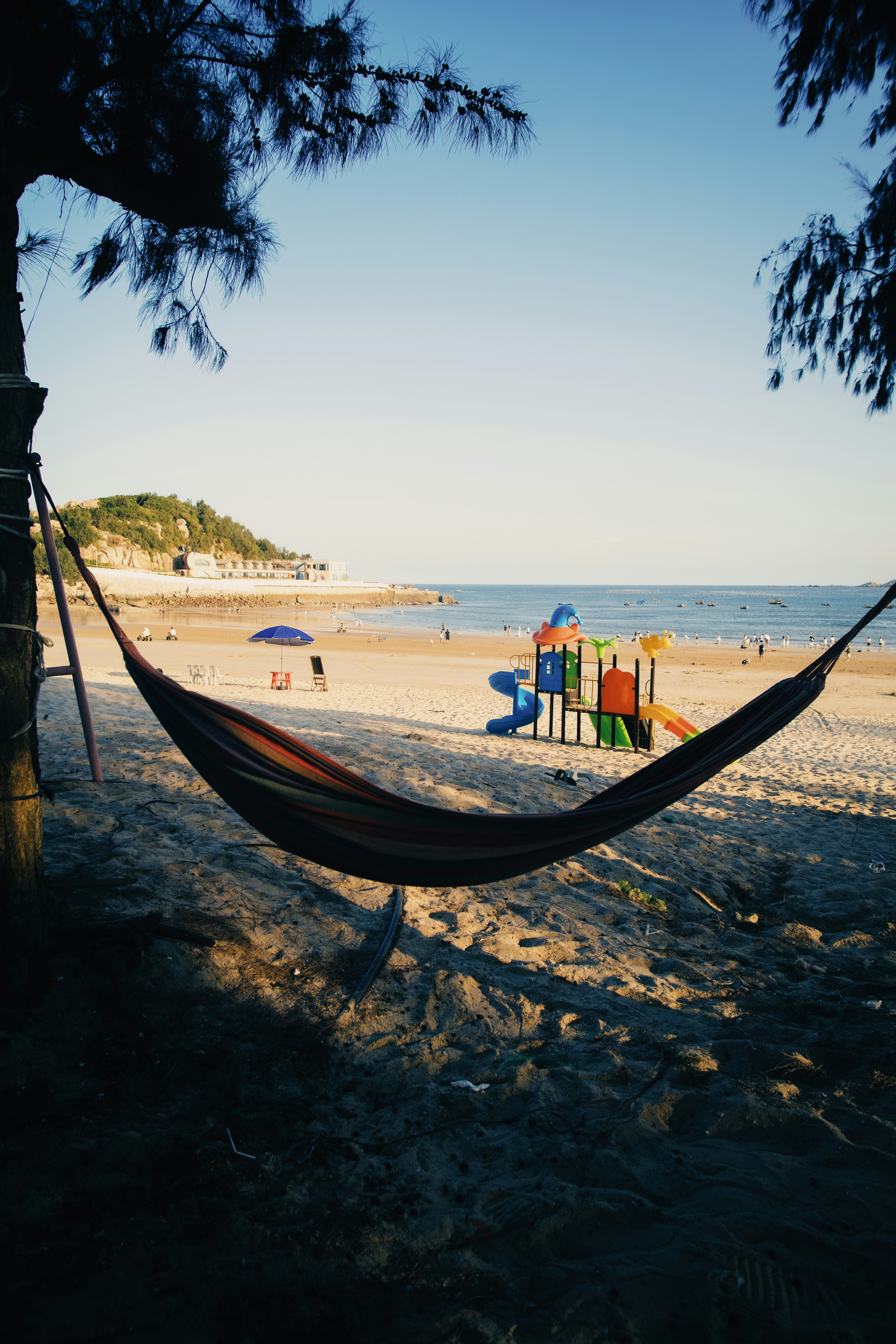 Hammock Over the Quiet Beach: A Sunny Afternoon Escape