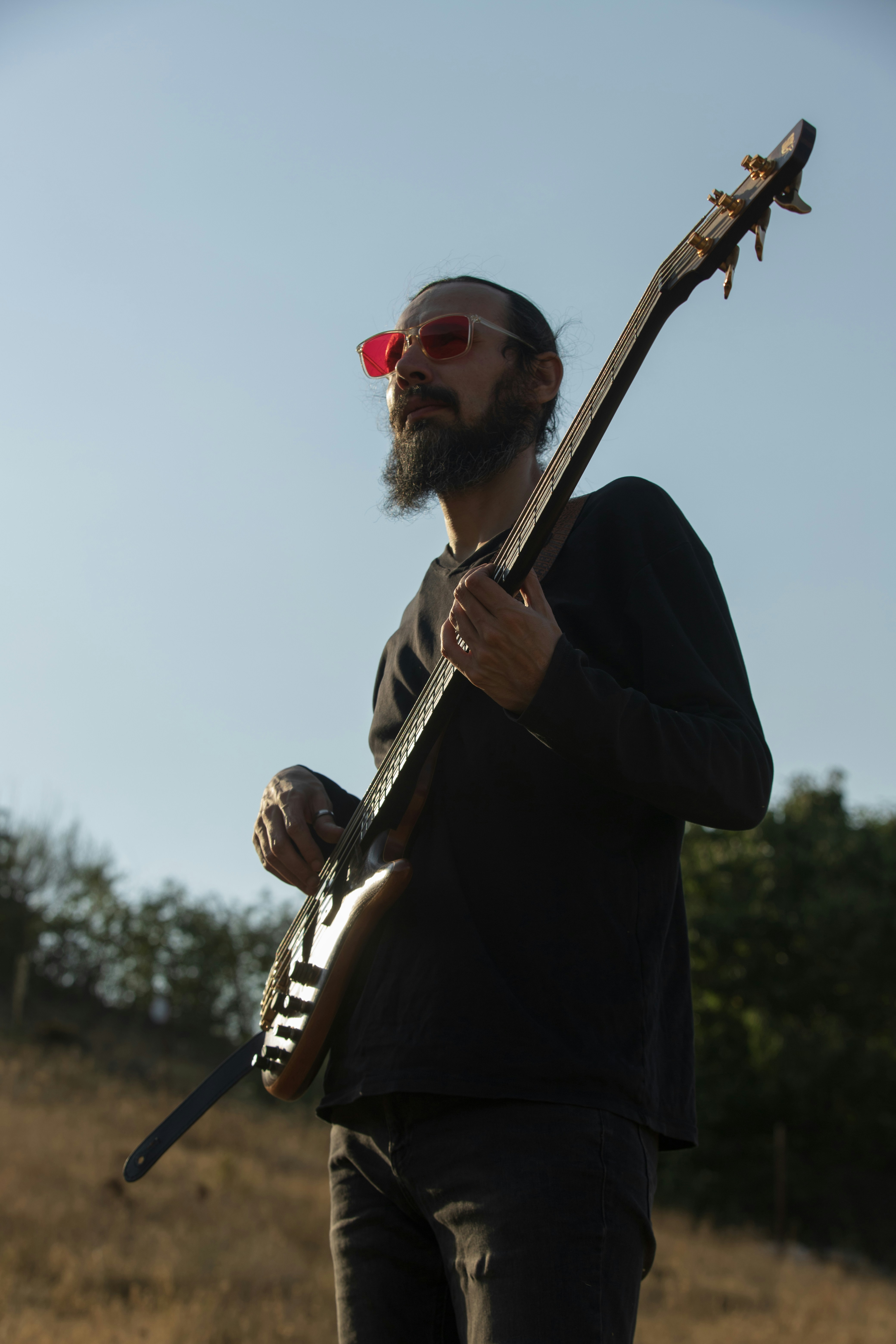 Crimson Sunglasses Bassist Carves a Sunlit Groove