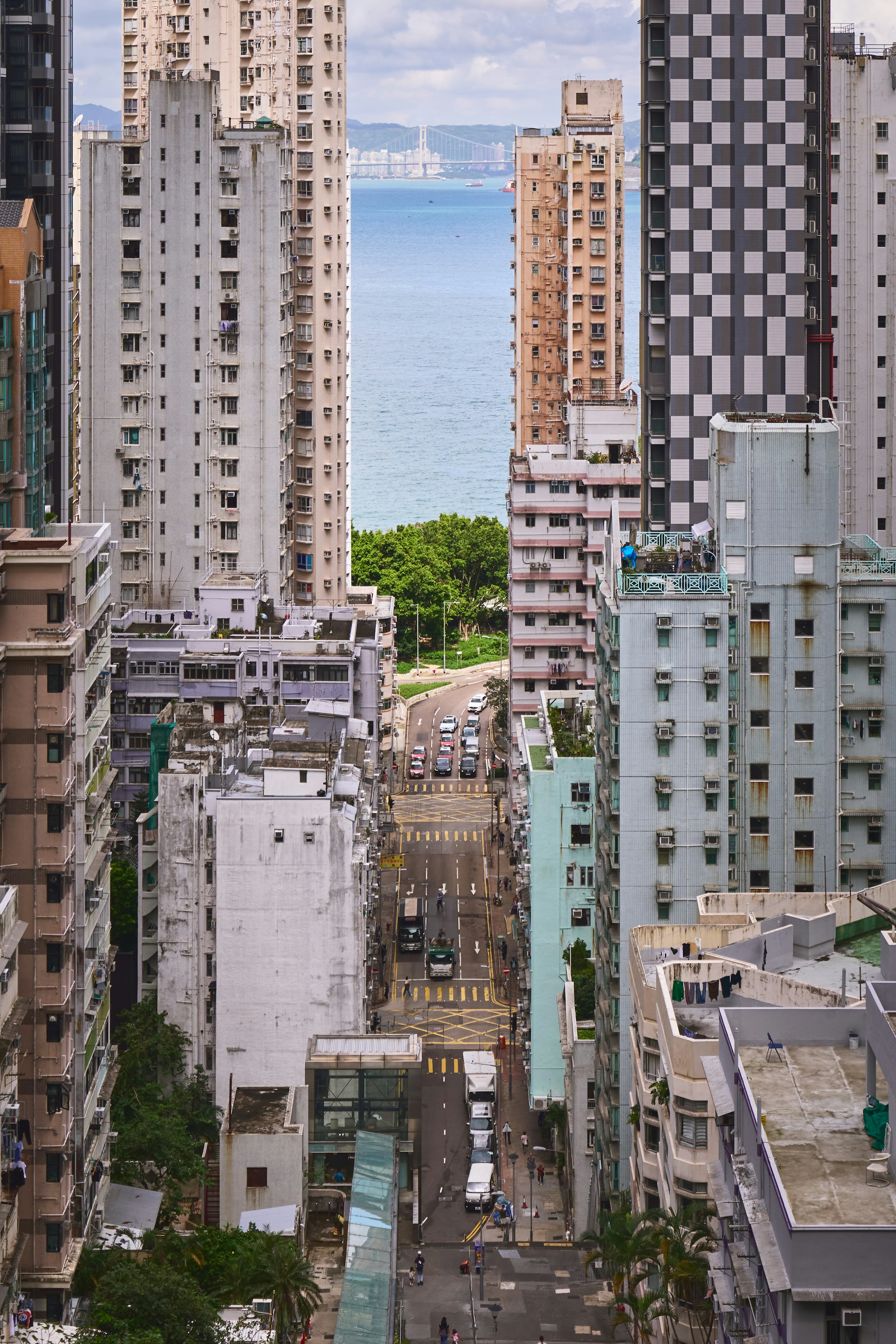 Urban Symphony: A Coastal View Through Concrete Towers