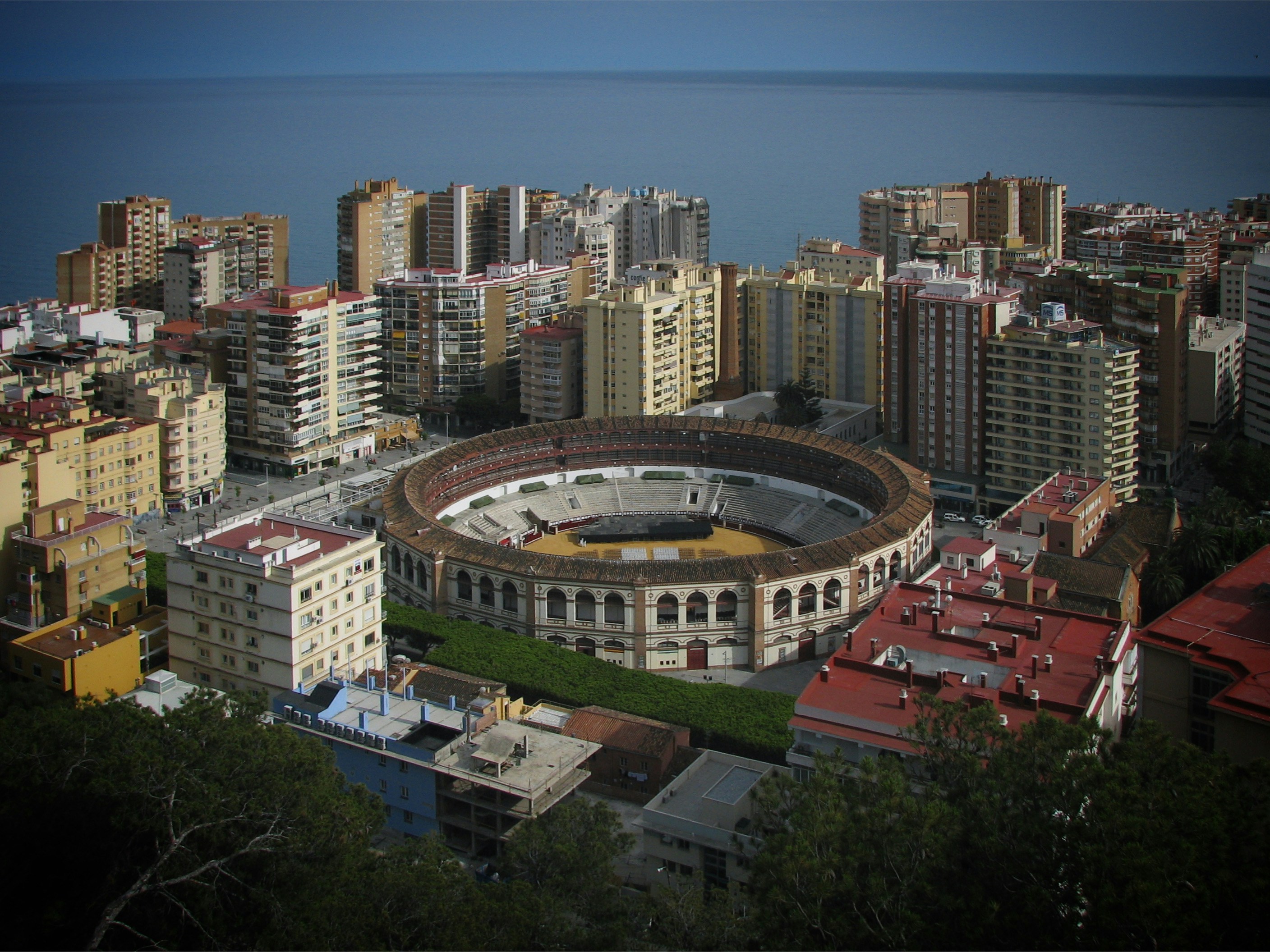 High angle view of Plaza de Toros de La Malagueta bullring in Málaga, Andalucía, Spain, May 2008 | Cityscape with a bullring and ocean view
