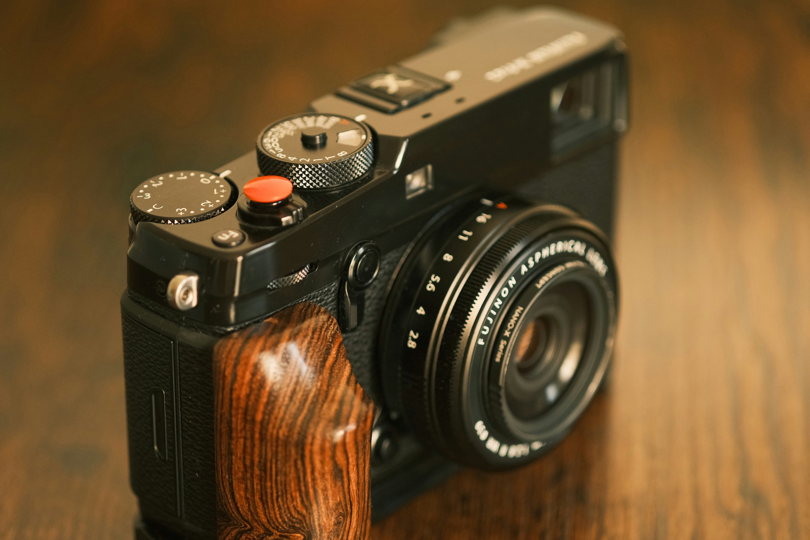 Fujifilm X Pro 2 XF27mmf2.8 | A black digital camera with a wooden grip.