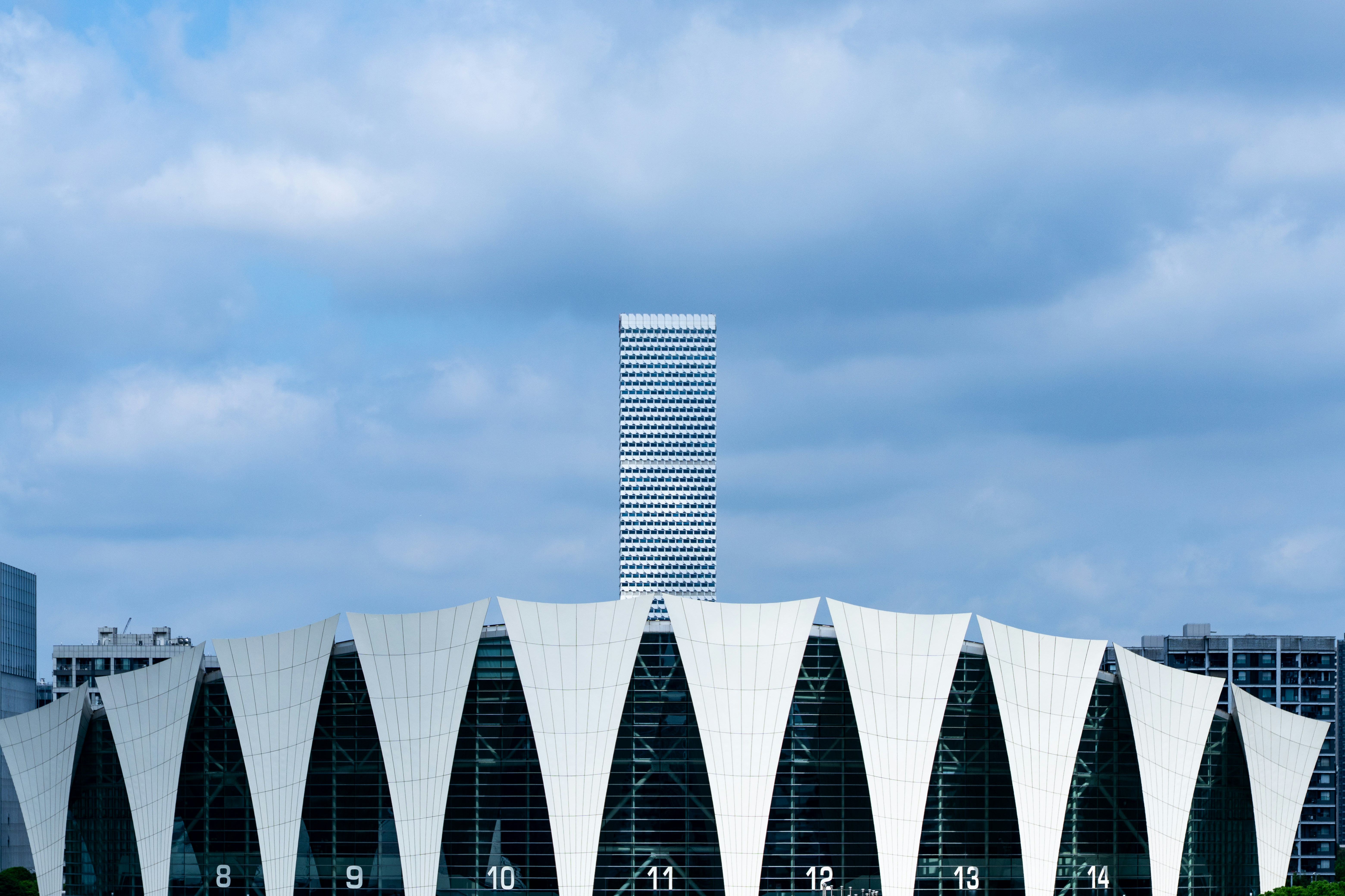 Modern stadium with a tall skyscraper behind photo – Free Building ...