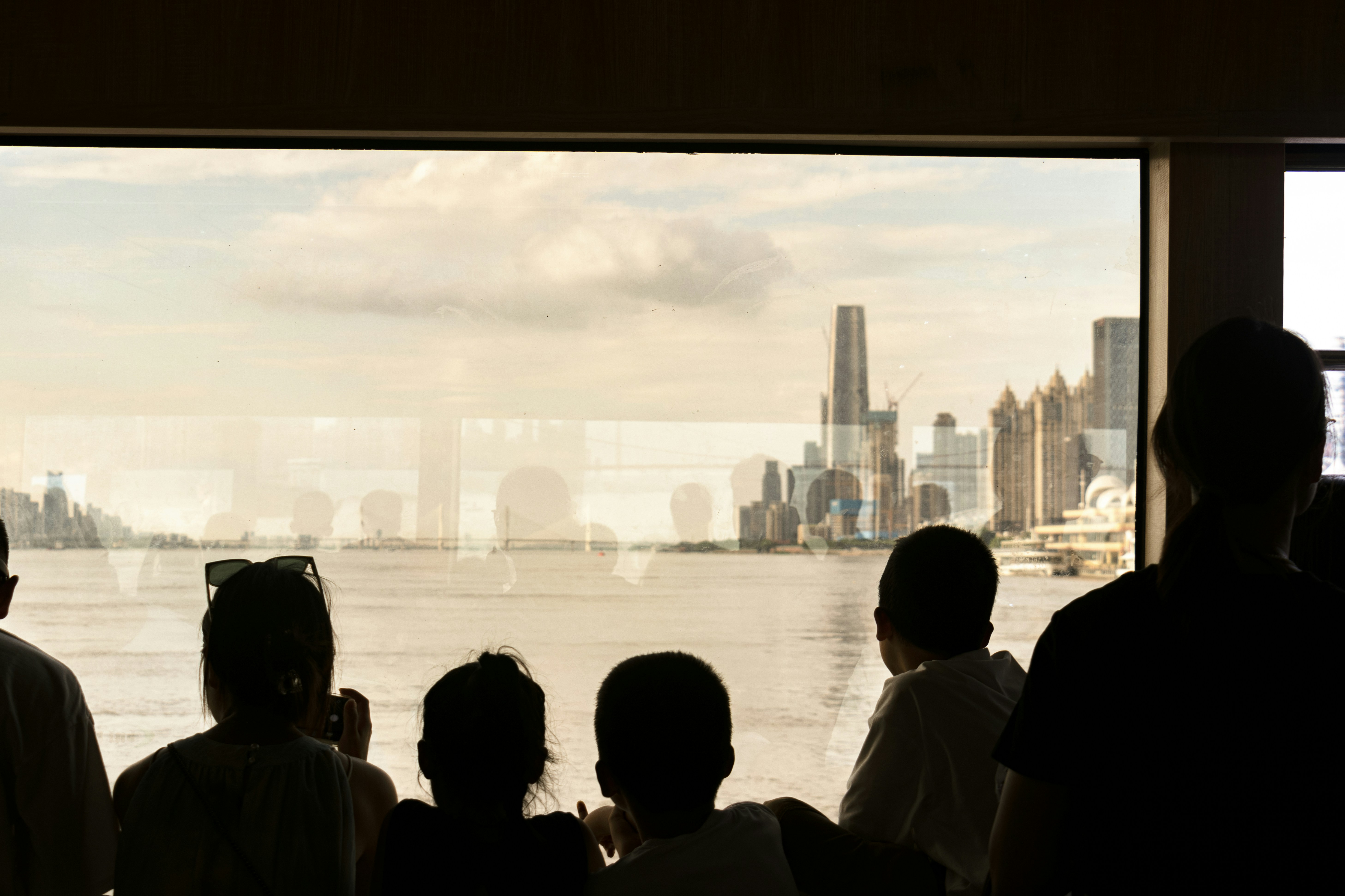 Harbor Window: Silhouettes Framing a City Across the Water