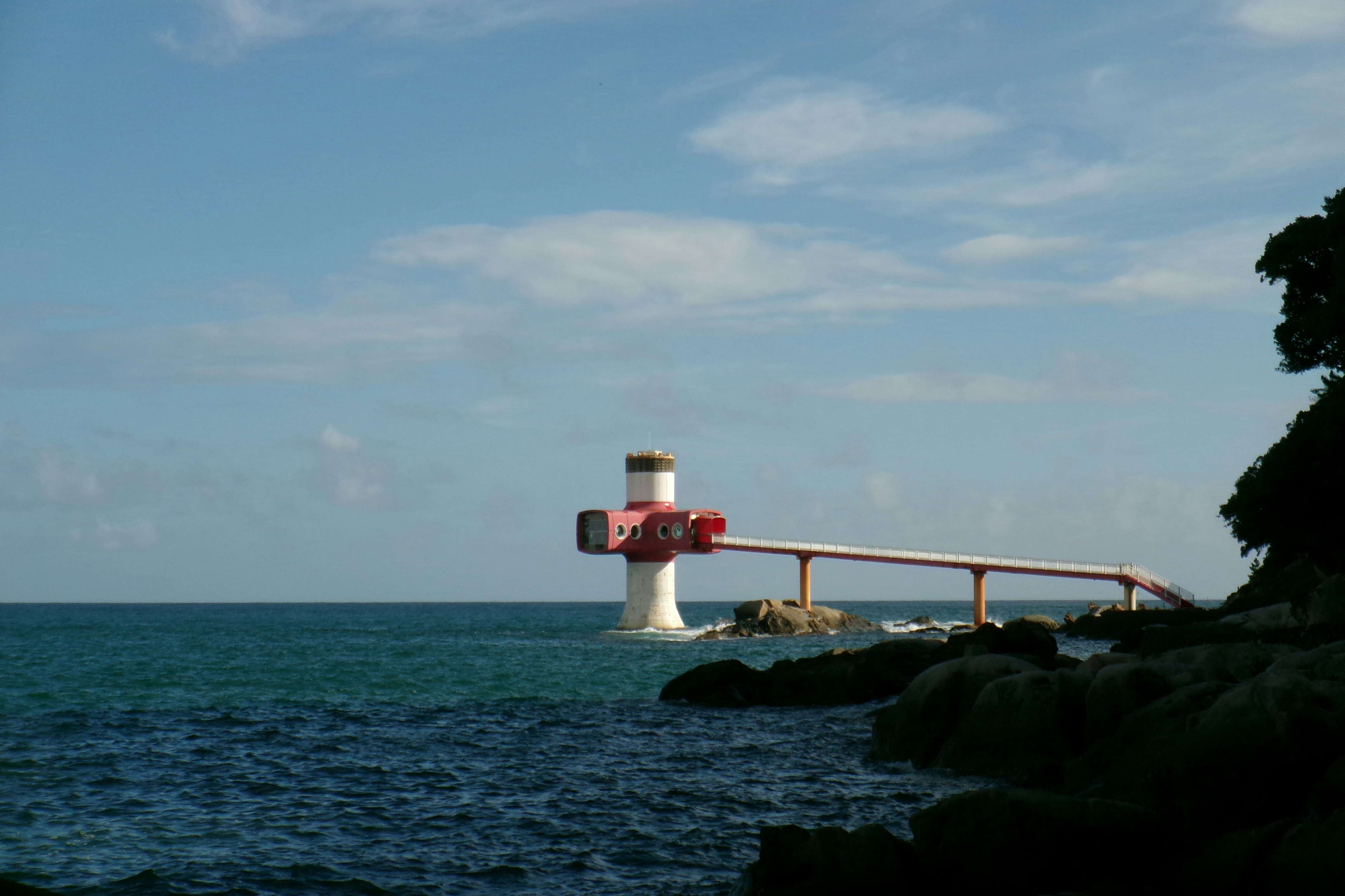 Lighthouse with a walkway over the ocean
