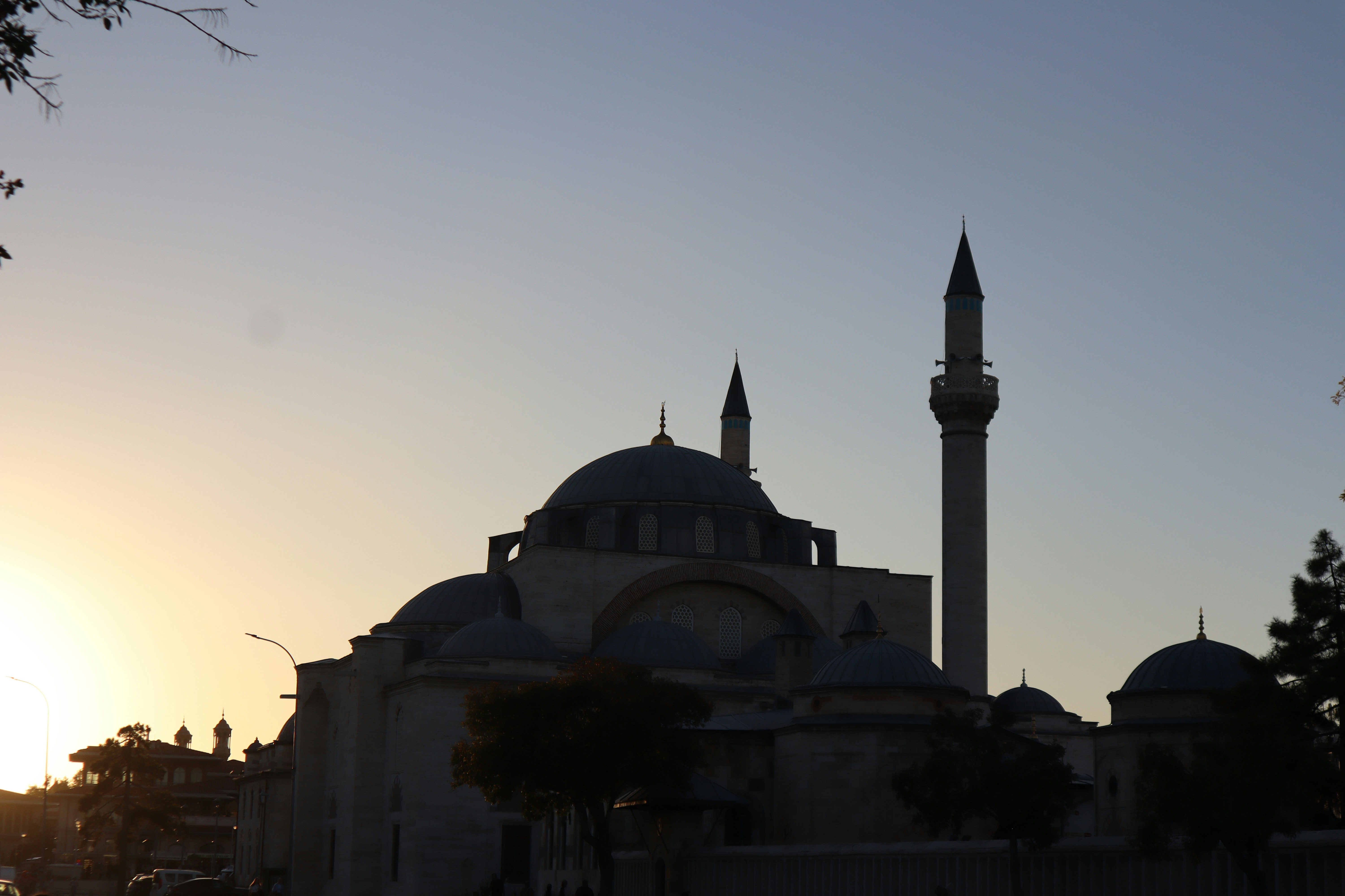 Whispers of Twilight: A Mosque Silhouette Against the Setting Sun