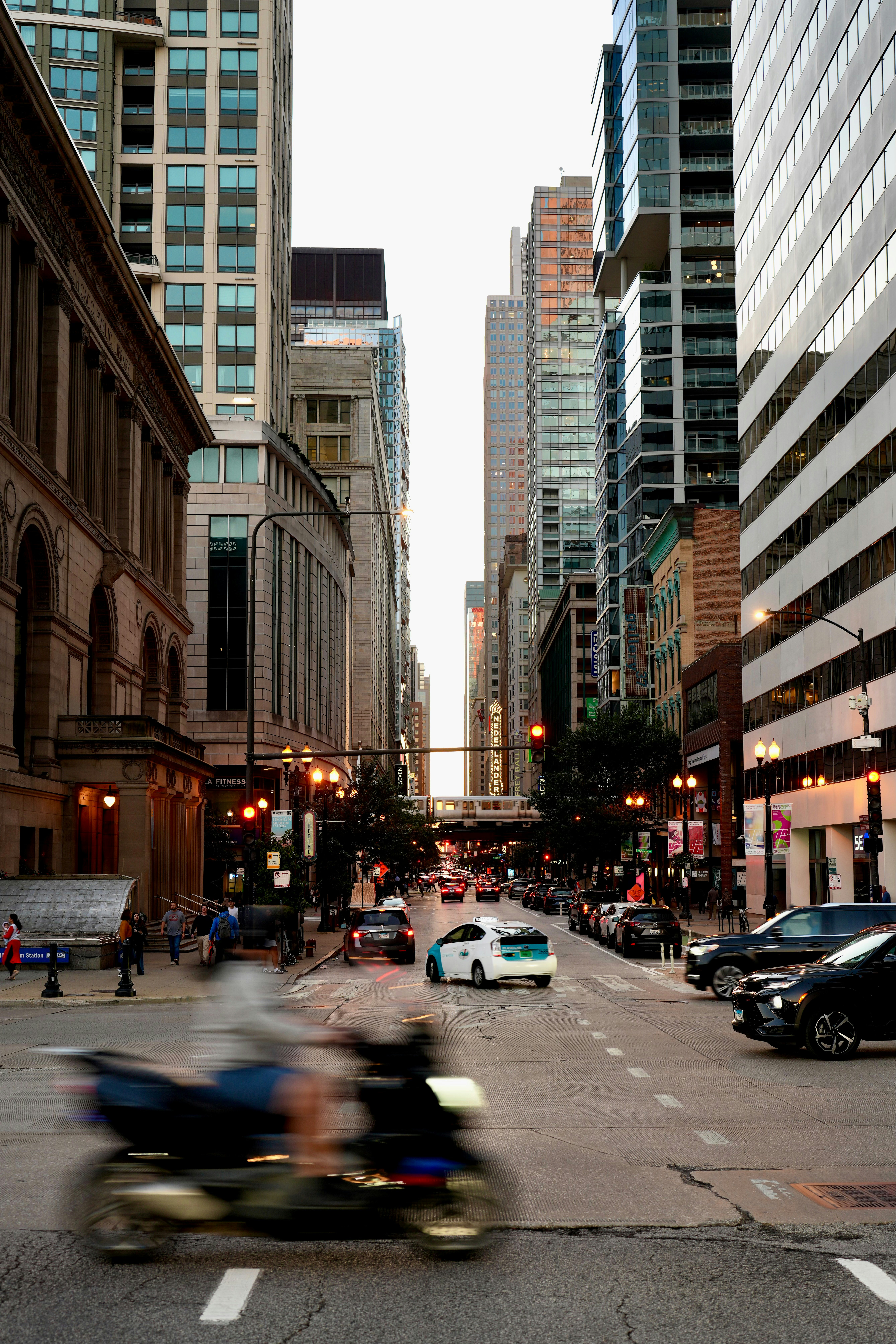 City street with tall buildings and traffic