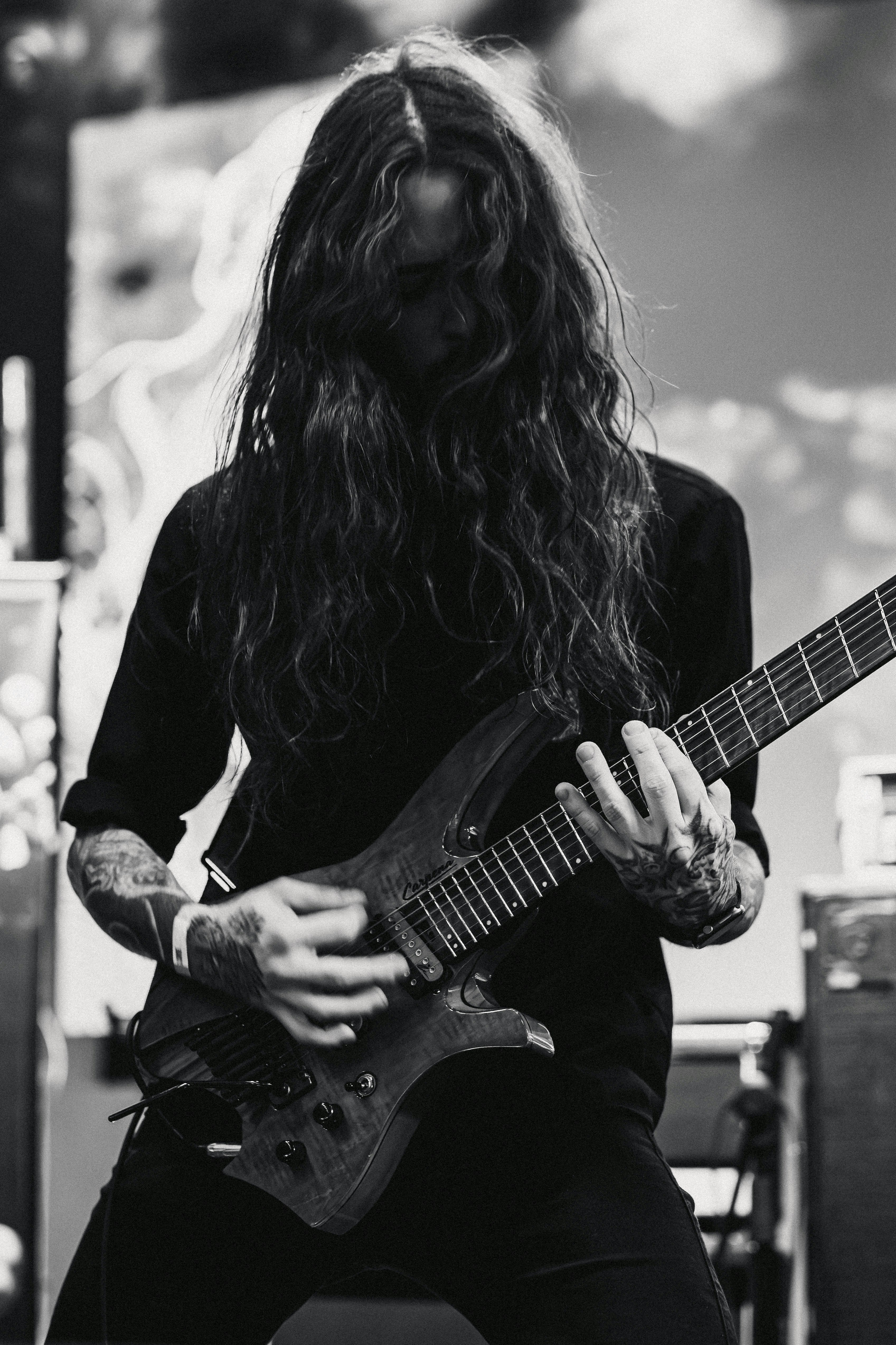 Strings of Emotion: A Guitarist's Intense Performance