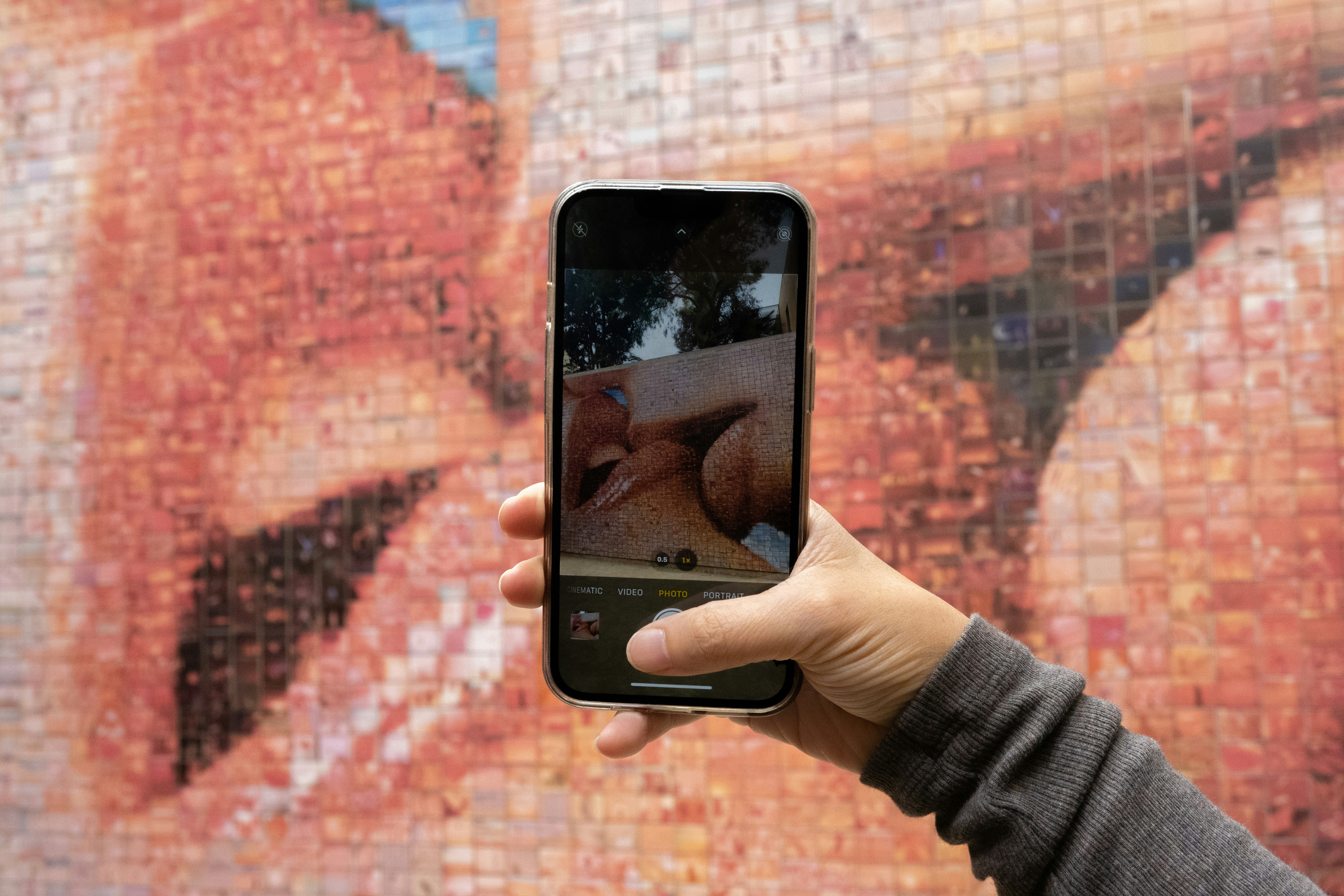 Frame Within a Frame: Handheld View of a Brick Mosaic Through a Smartphone