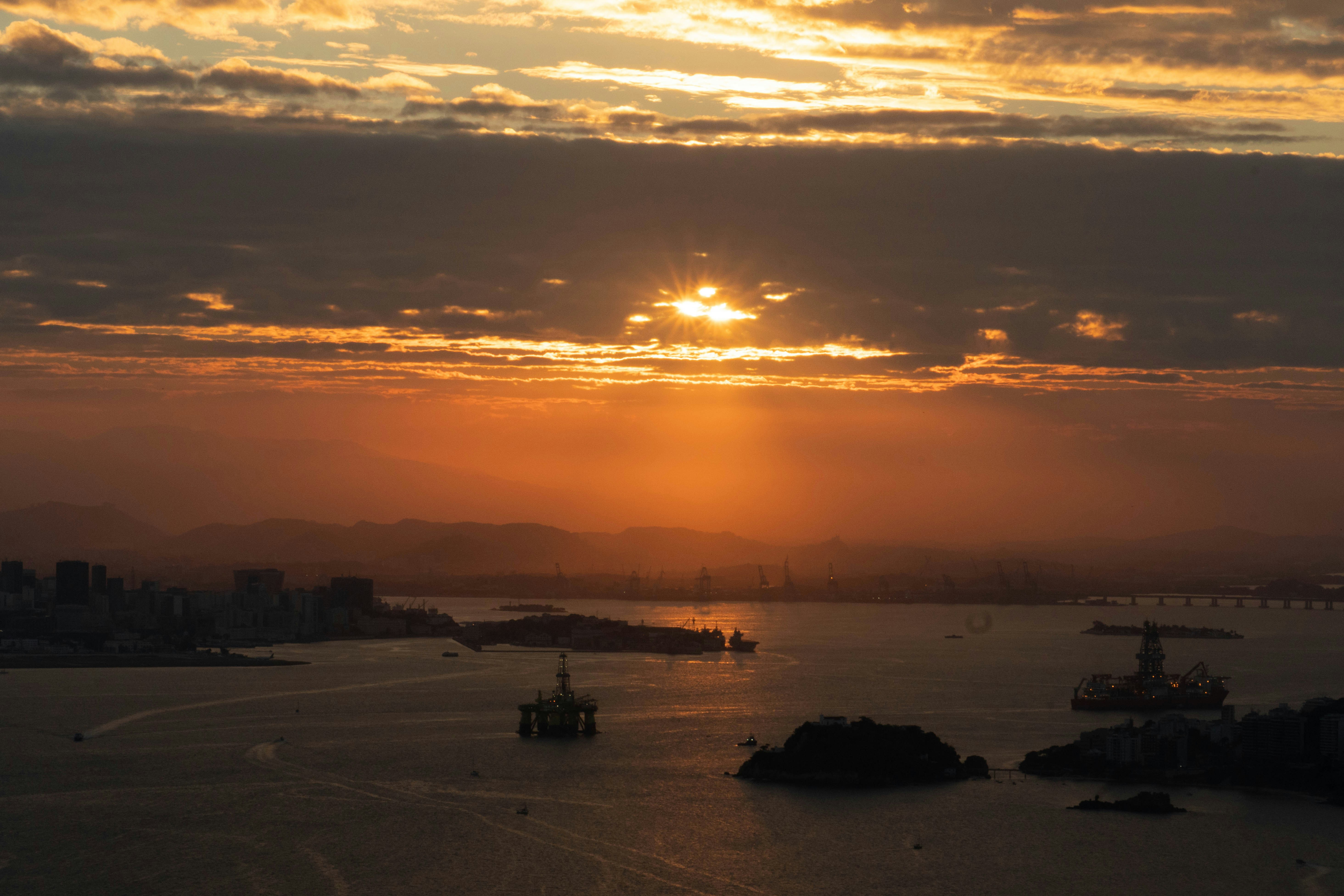 Sunset Breakwater: Golden Rays Over a Quiet Harbor