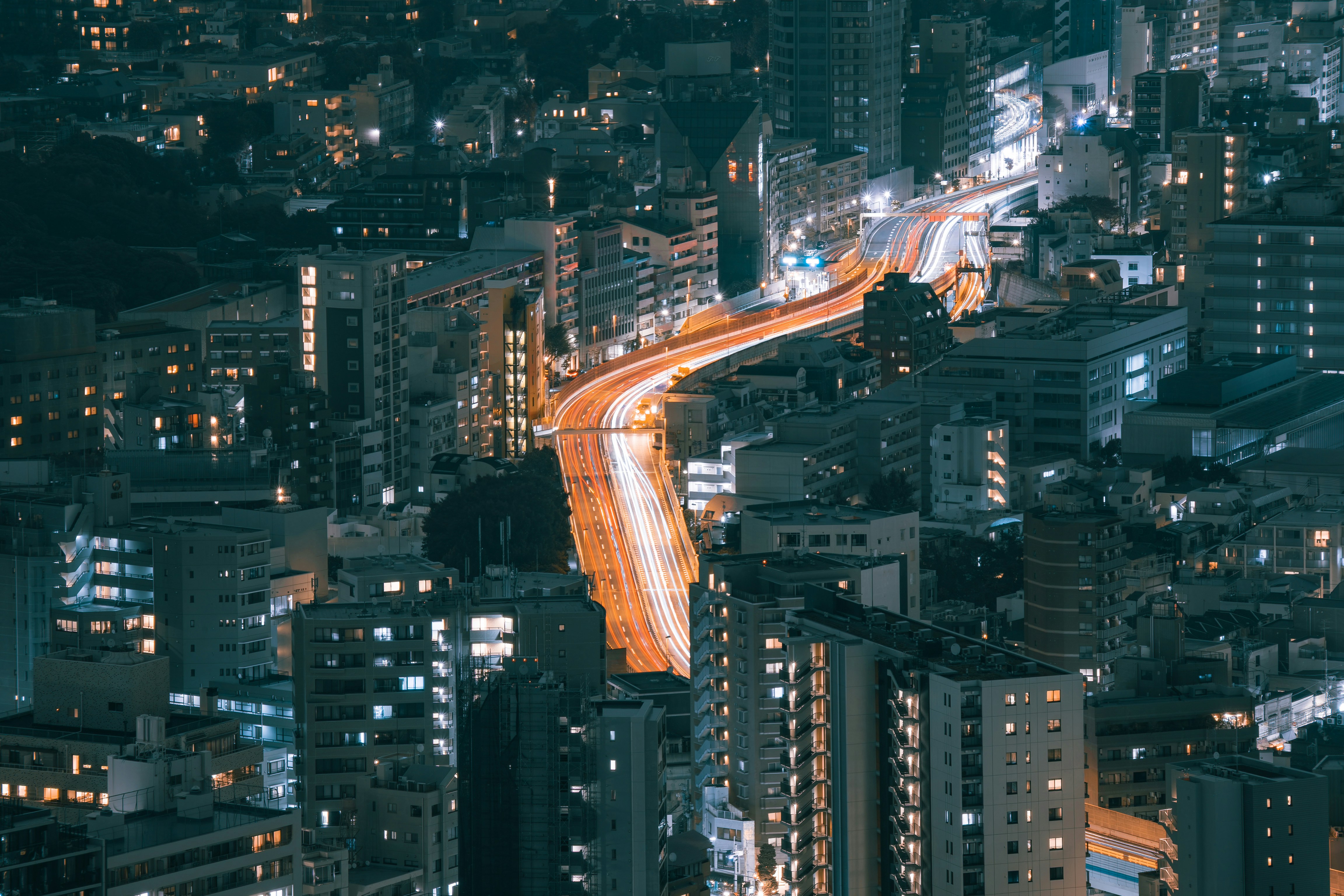 Vibrant cityscape with light trails at night