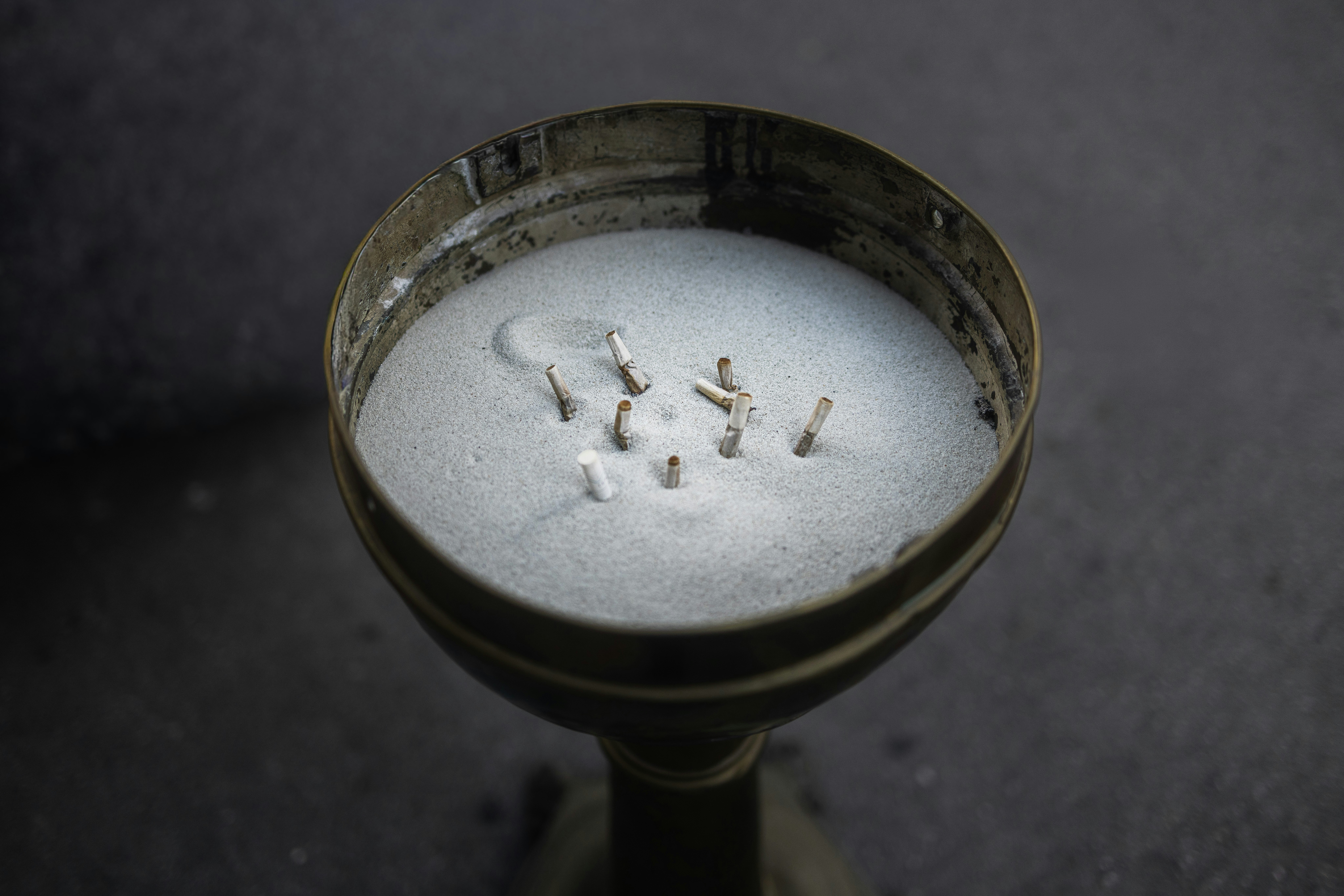 Incense sticks in a sand-filled holder