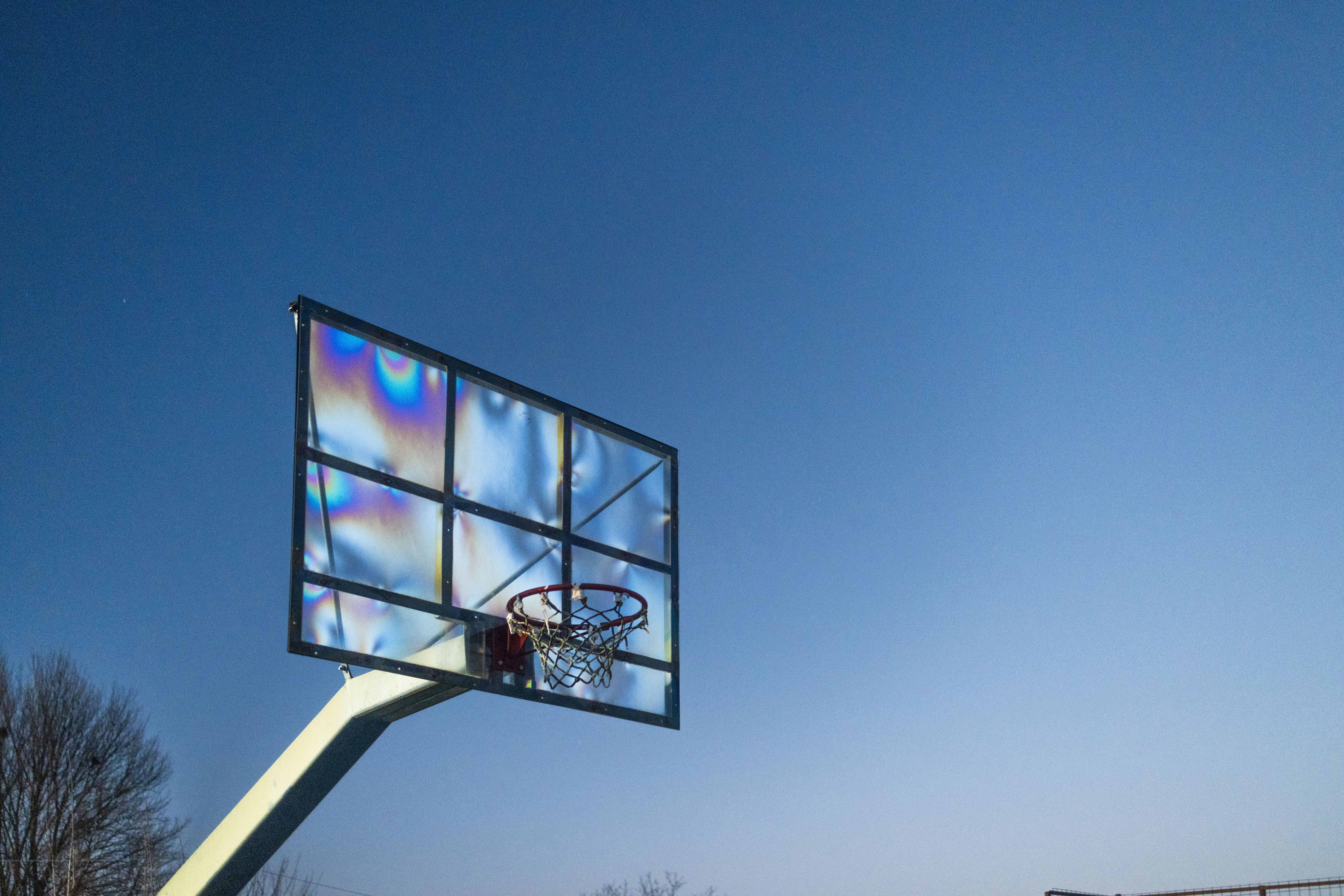 Reflections of Play: A Hoop Beneath the Sky