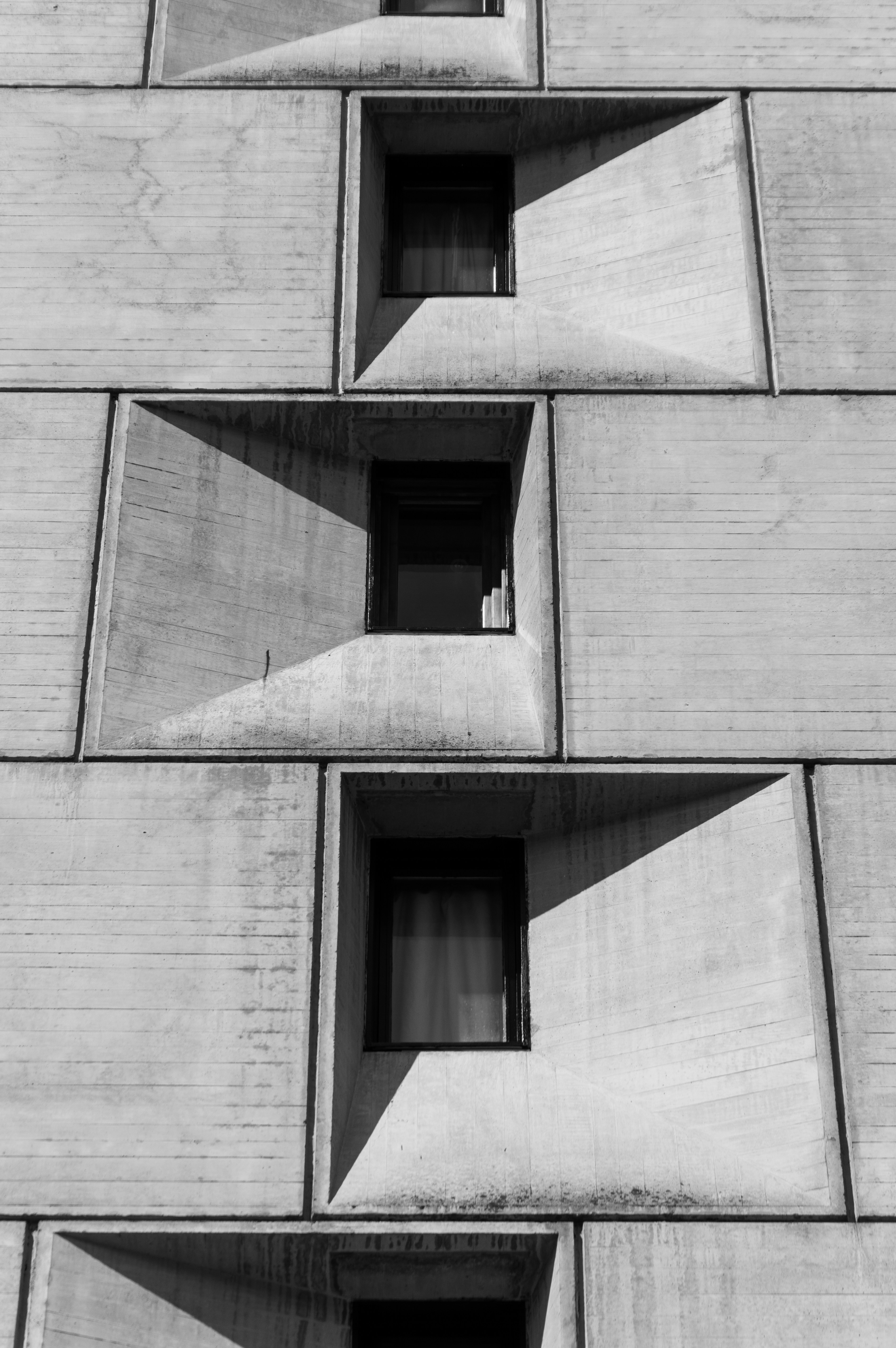 Modern concrete building facade with recessed windows photo – Free ...