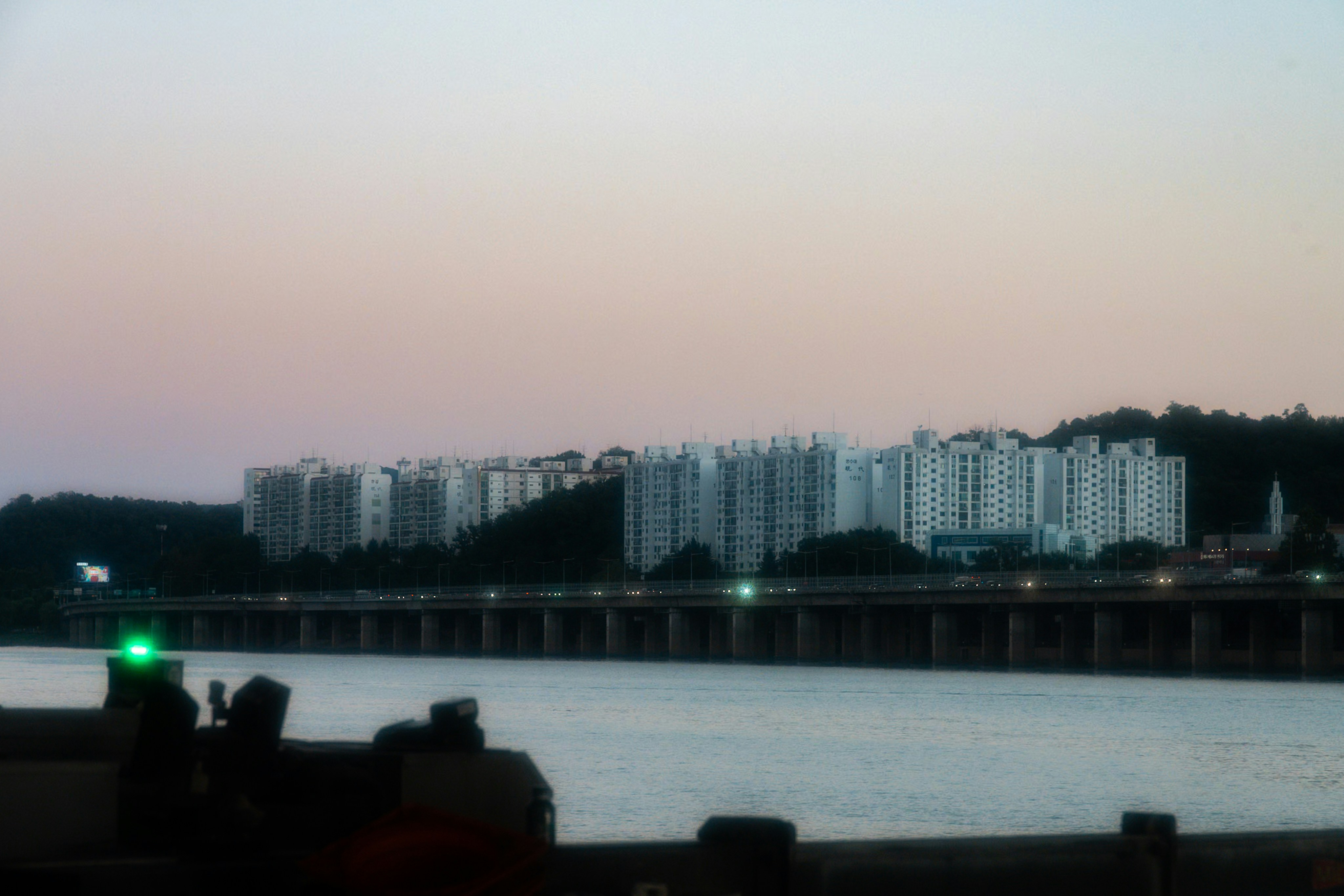 Urban Serenity at Dusk: A City by the Water
