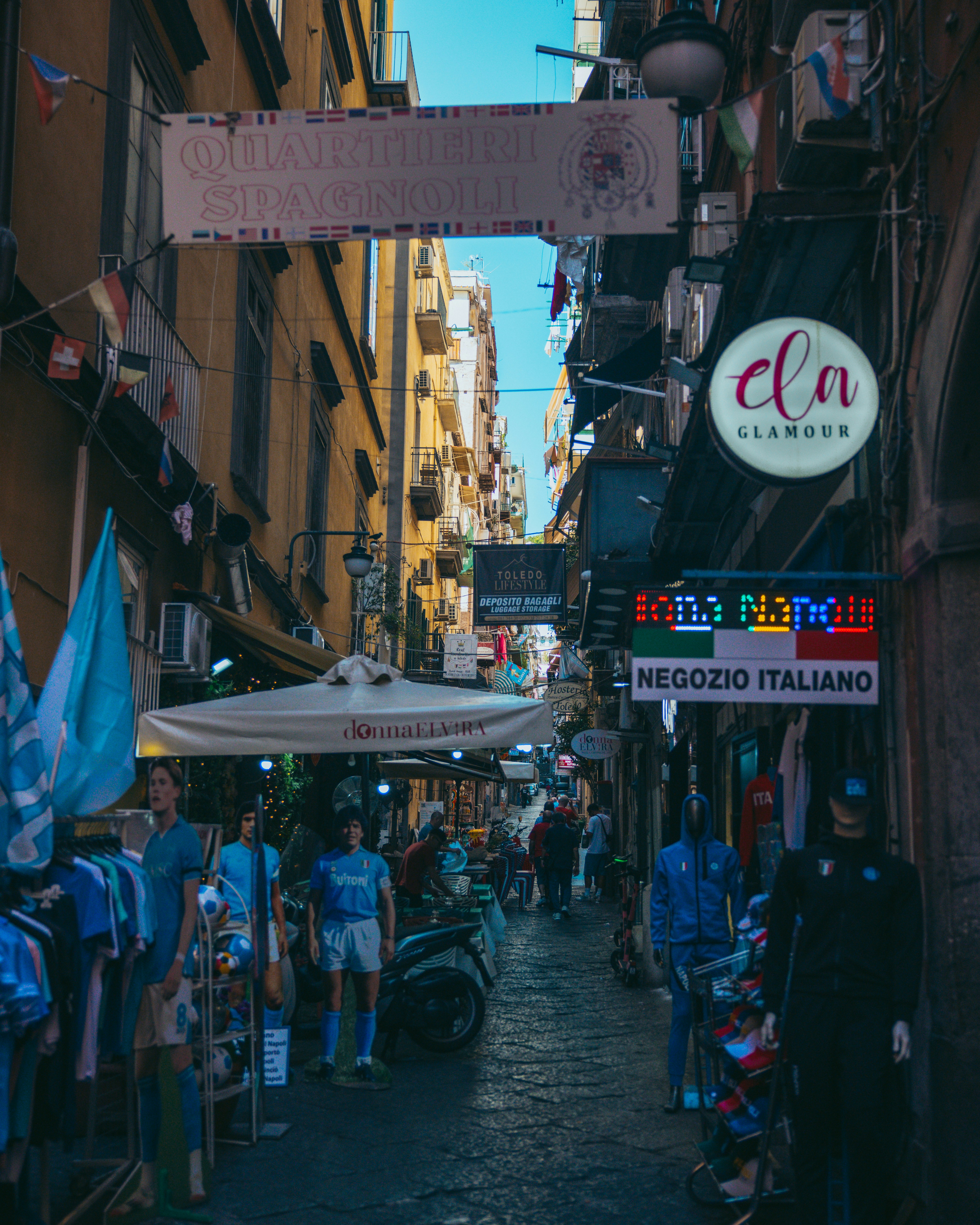 Alleyway Bazaar: Neon Signs and Narrow Streets of a European Market