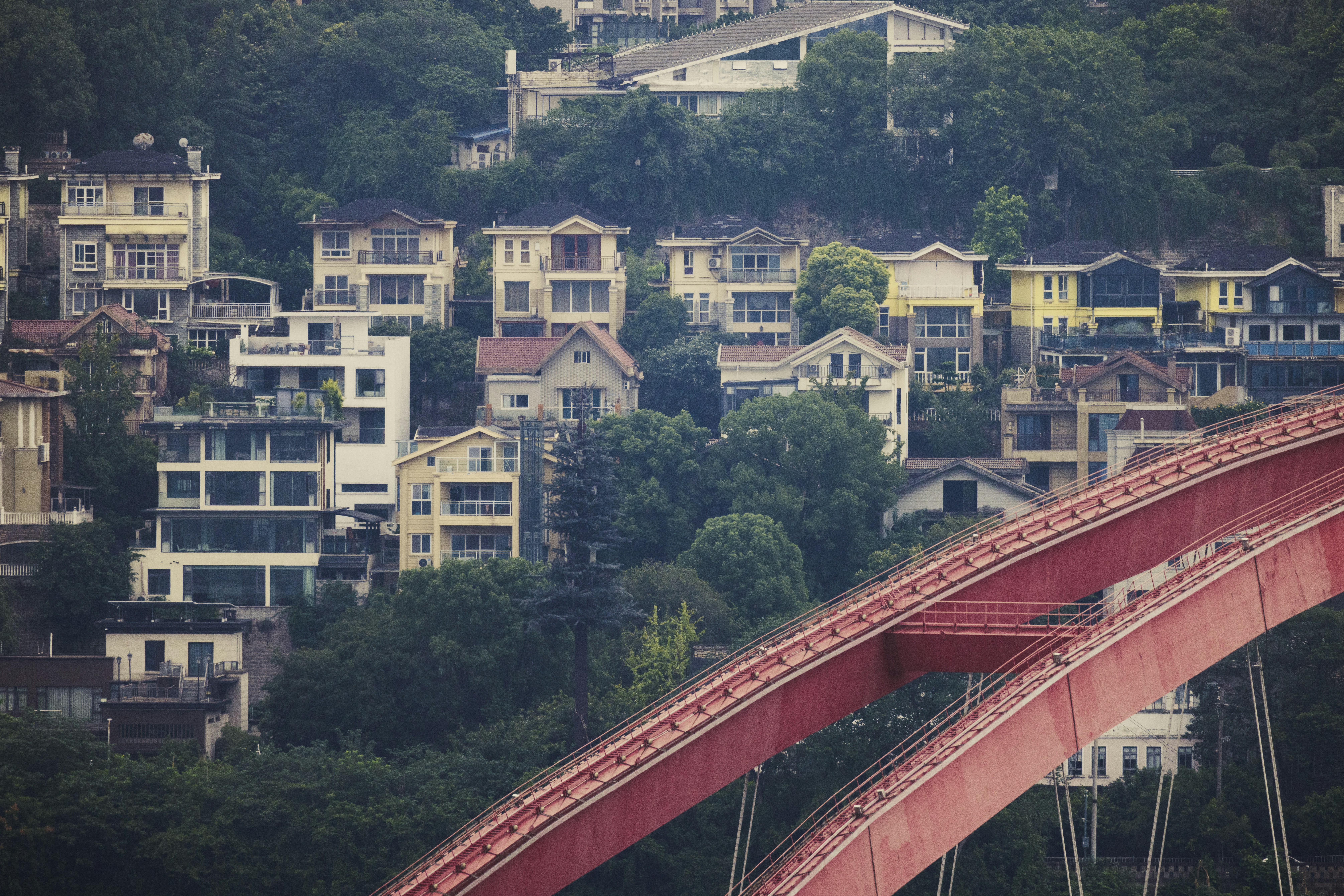 Urban Harmony: A Bridge Over Colorful Abodes