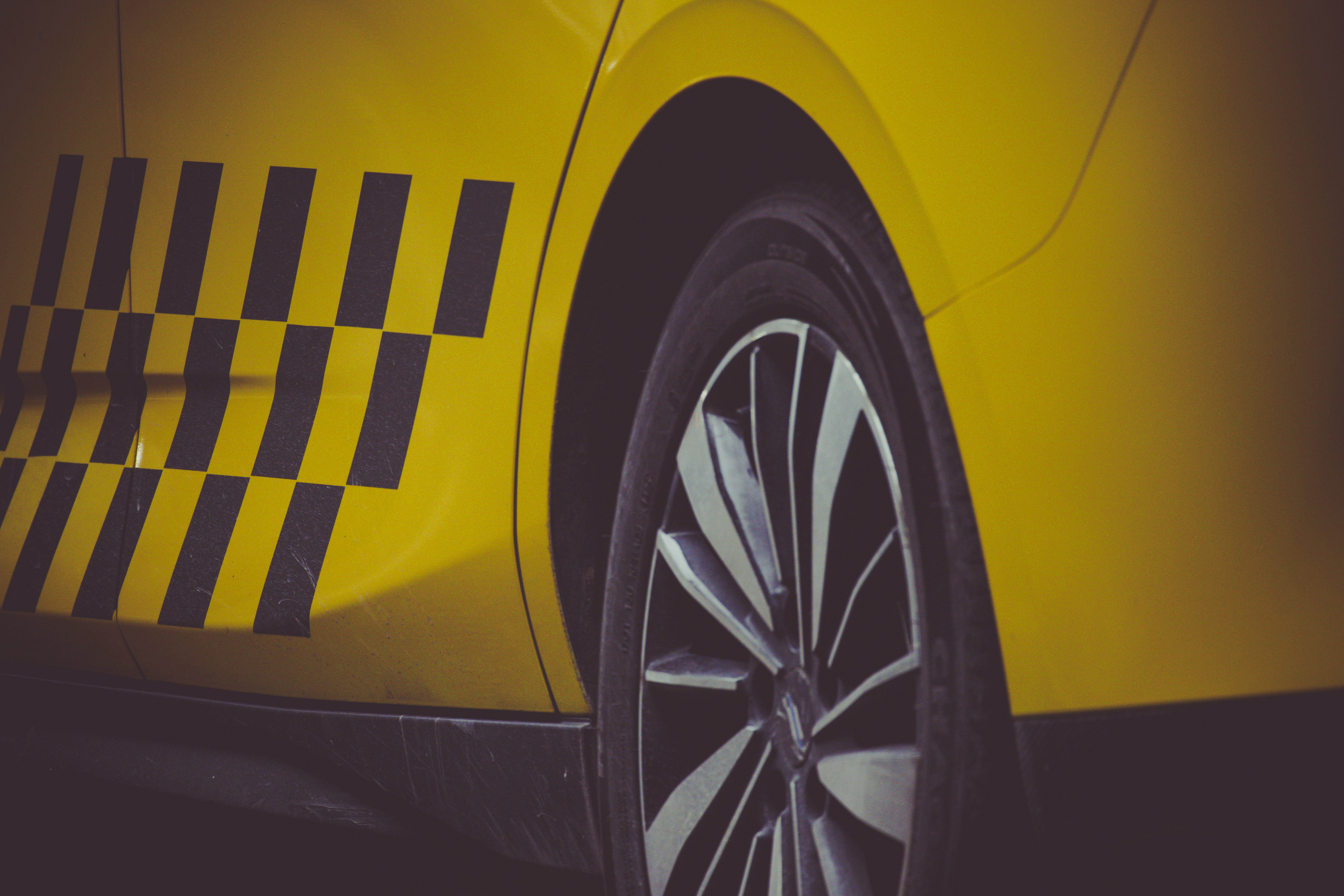 Yellow taxi with checkered pattern detail photo – Free Travel Image on ...