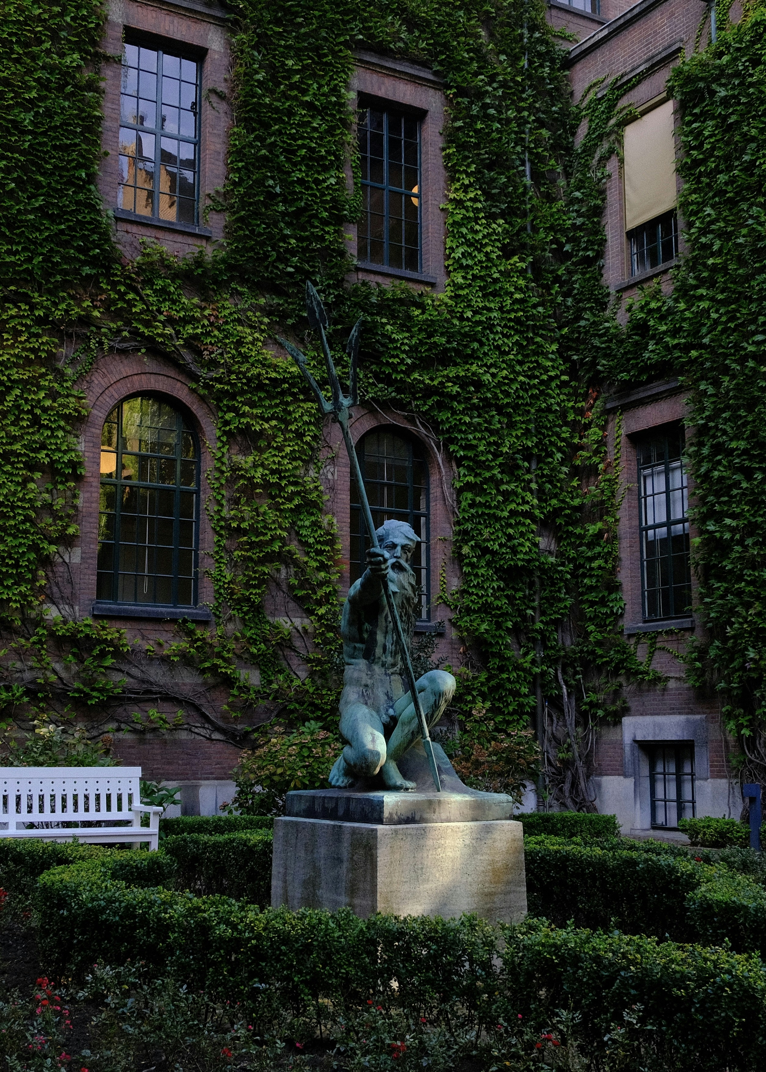 Guardian of the Green: A Sculpture in Nature's Embrace