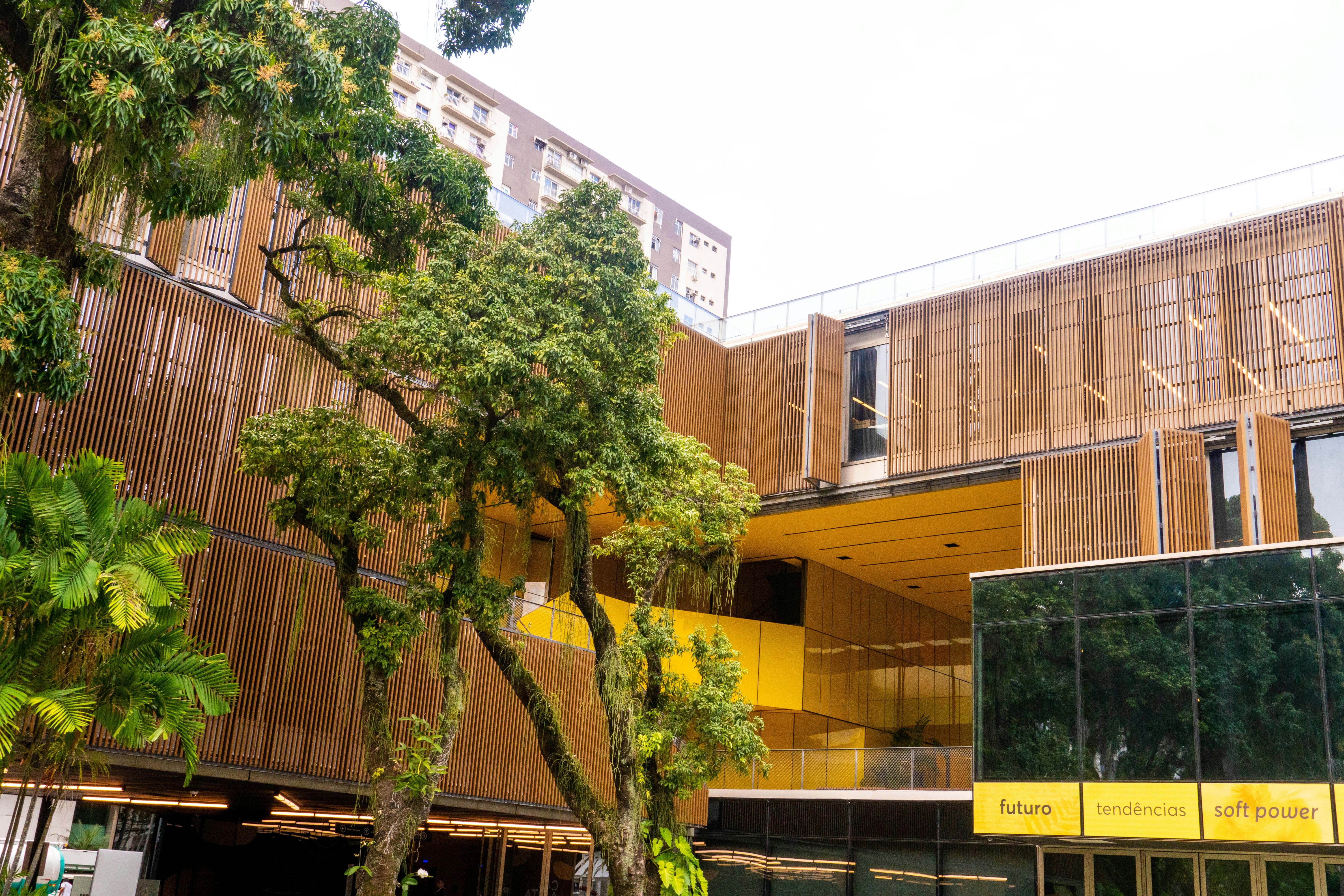 Architectural structure blends seamlessly with surrounding greenery, showcasing innovative design elements and sustainable architecture.