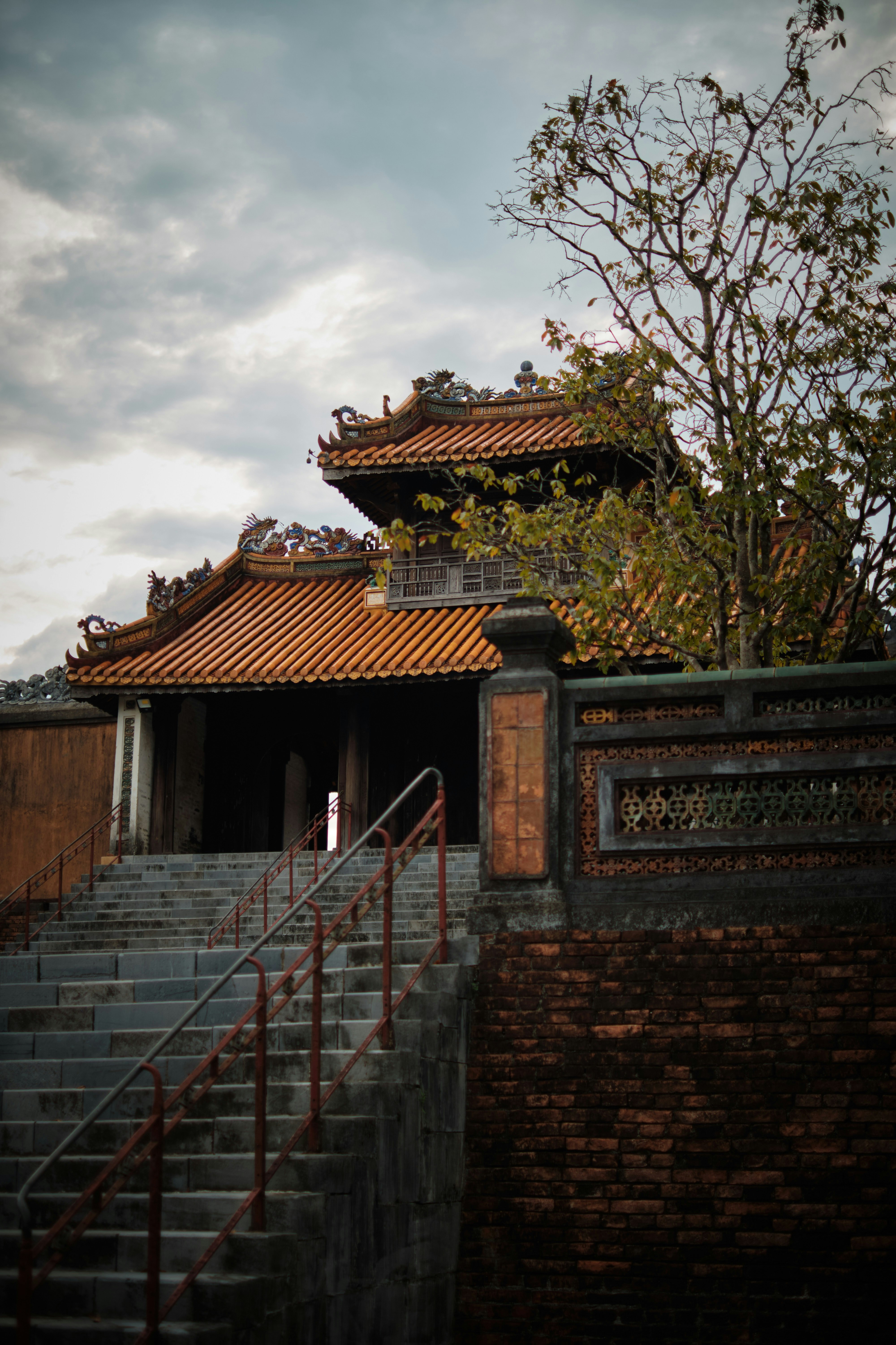 Stone steps lead to an ornate ancient building entrance.