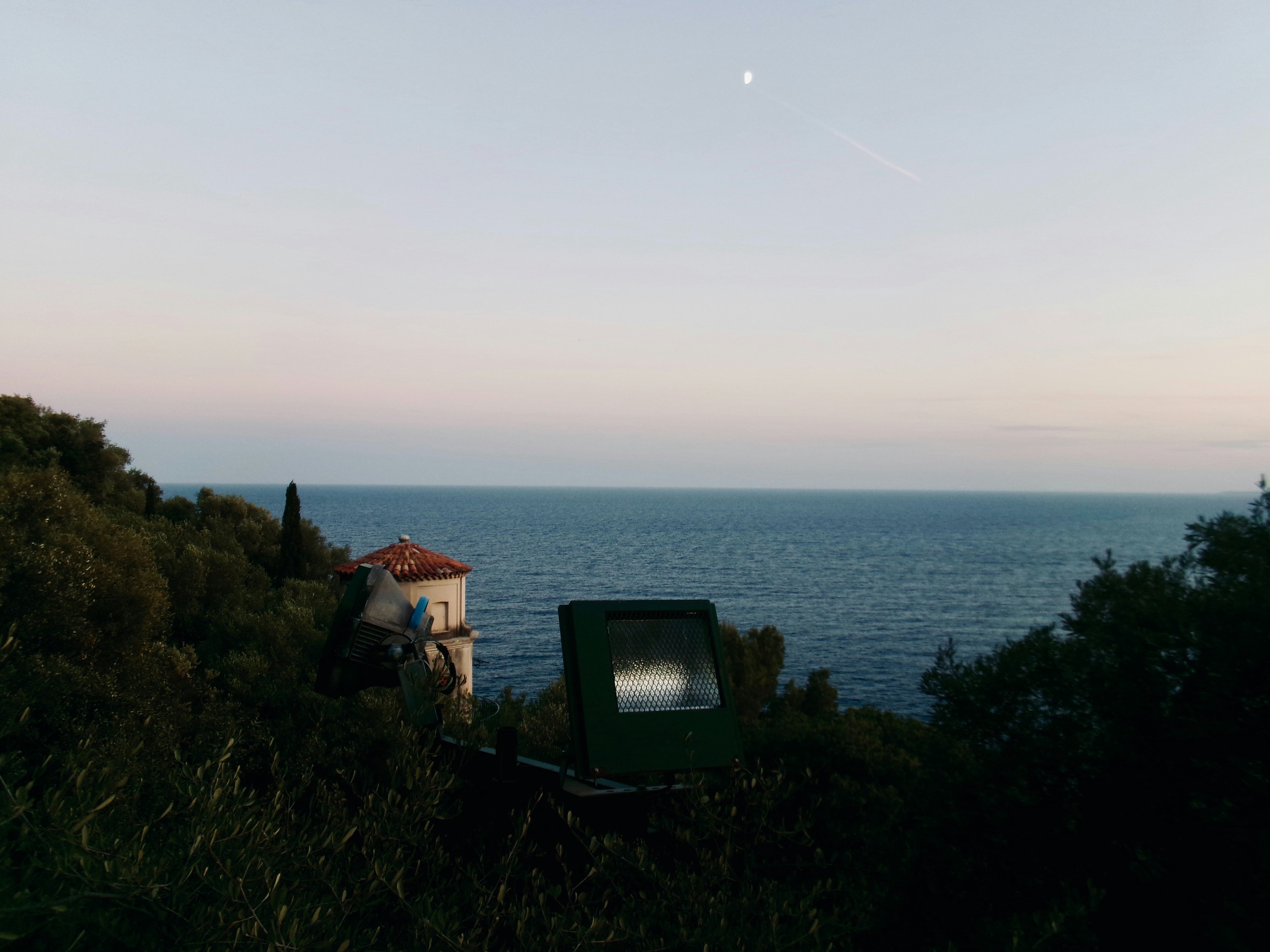 Summer 2025, Nice, France | Ocean view with a house and green structure.