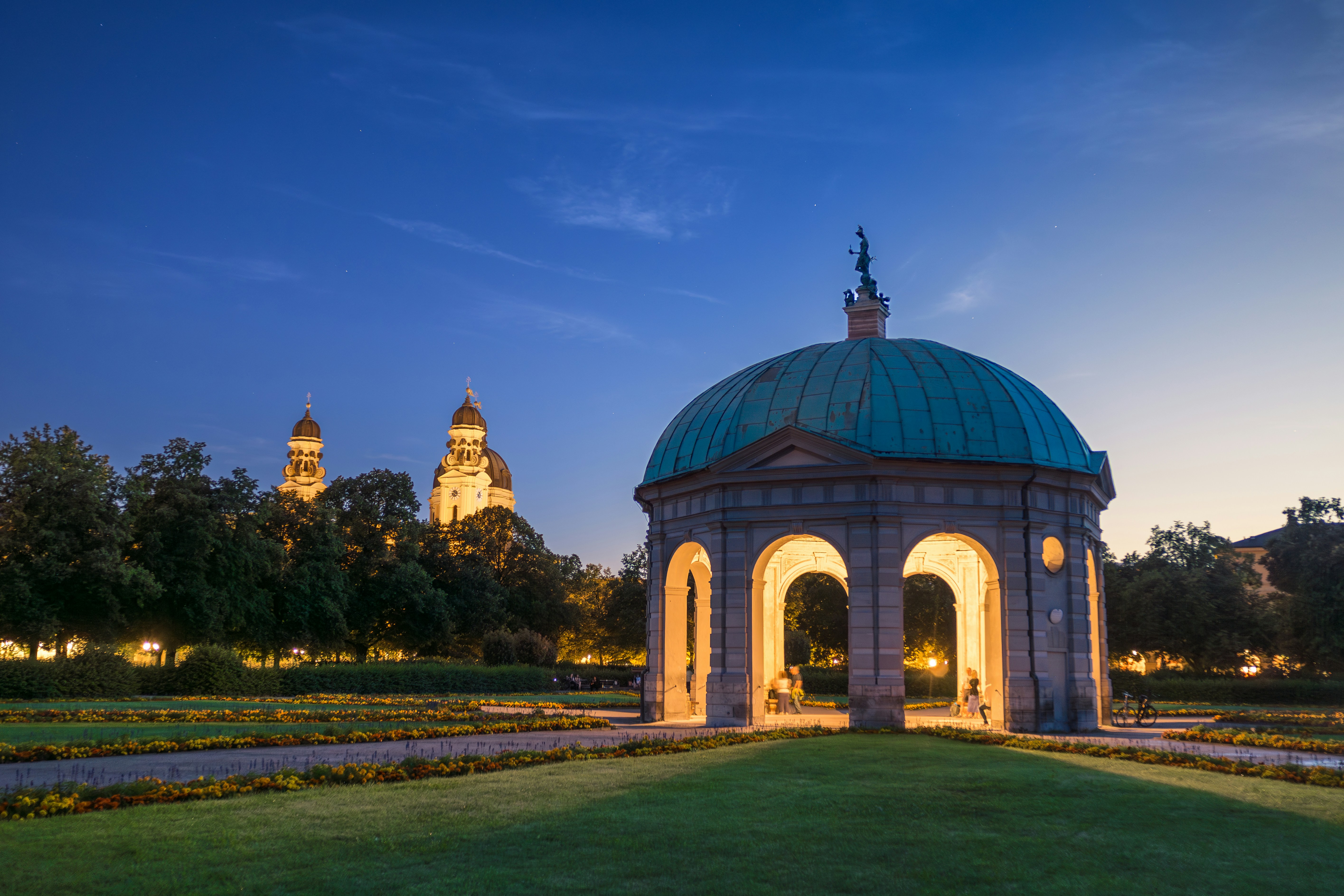 Ornate pavilion in a park at dusk