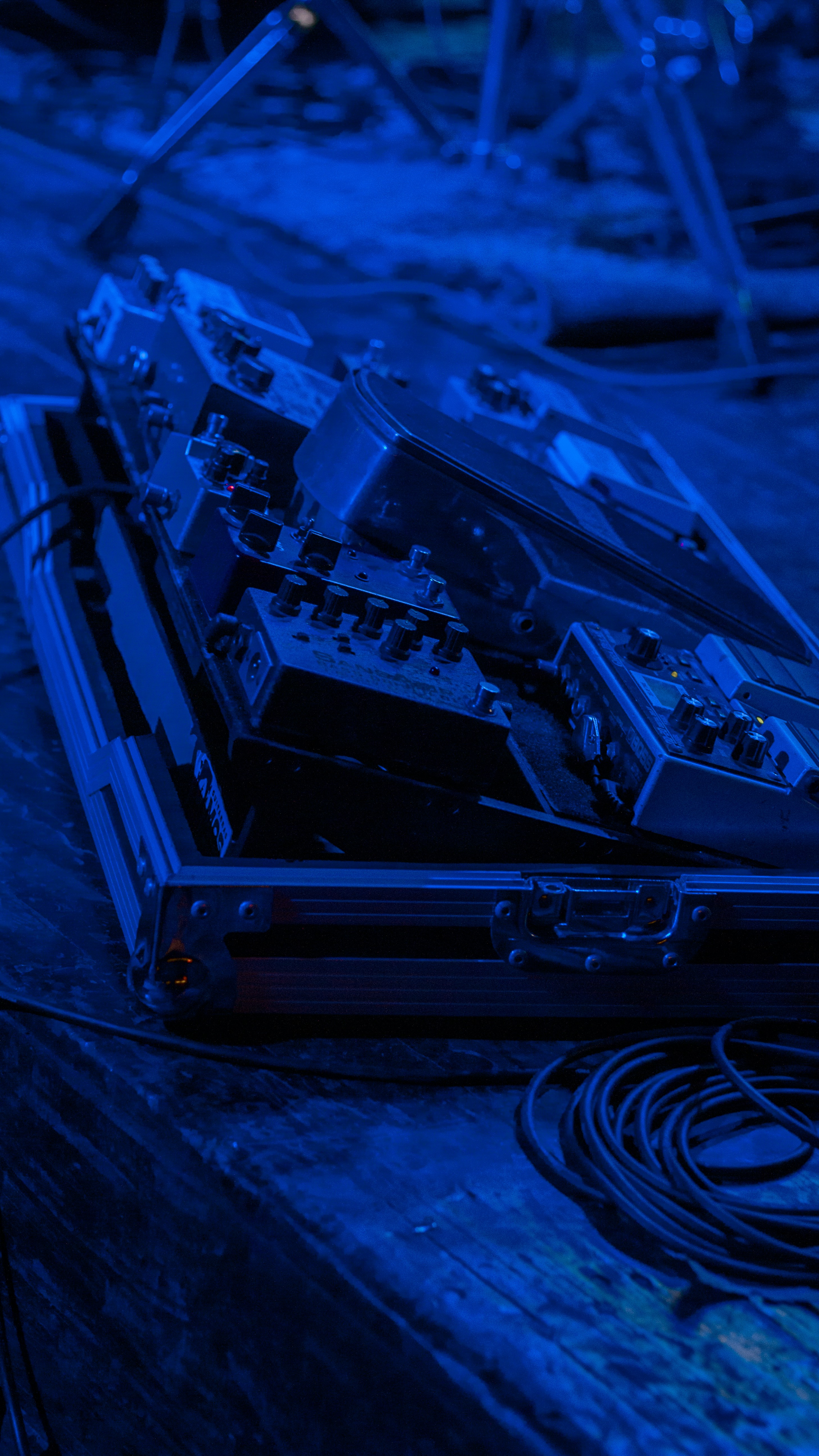 Blue-lit Flight-Case Rig: A Quiet Pulse of Stage Audio Hardware
