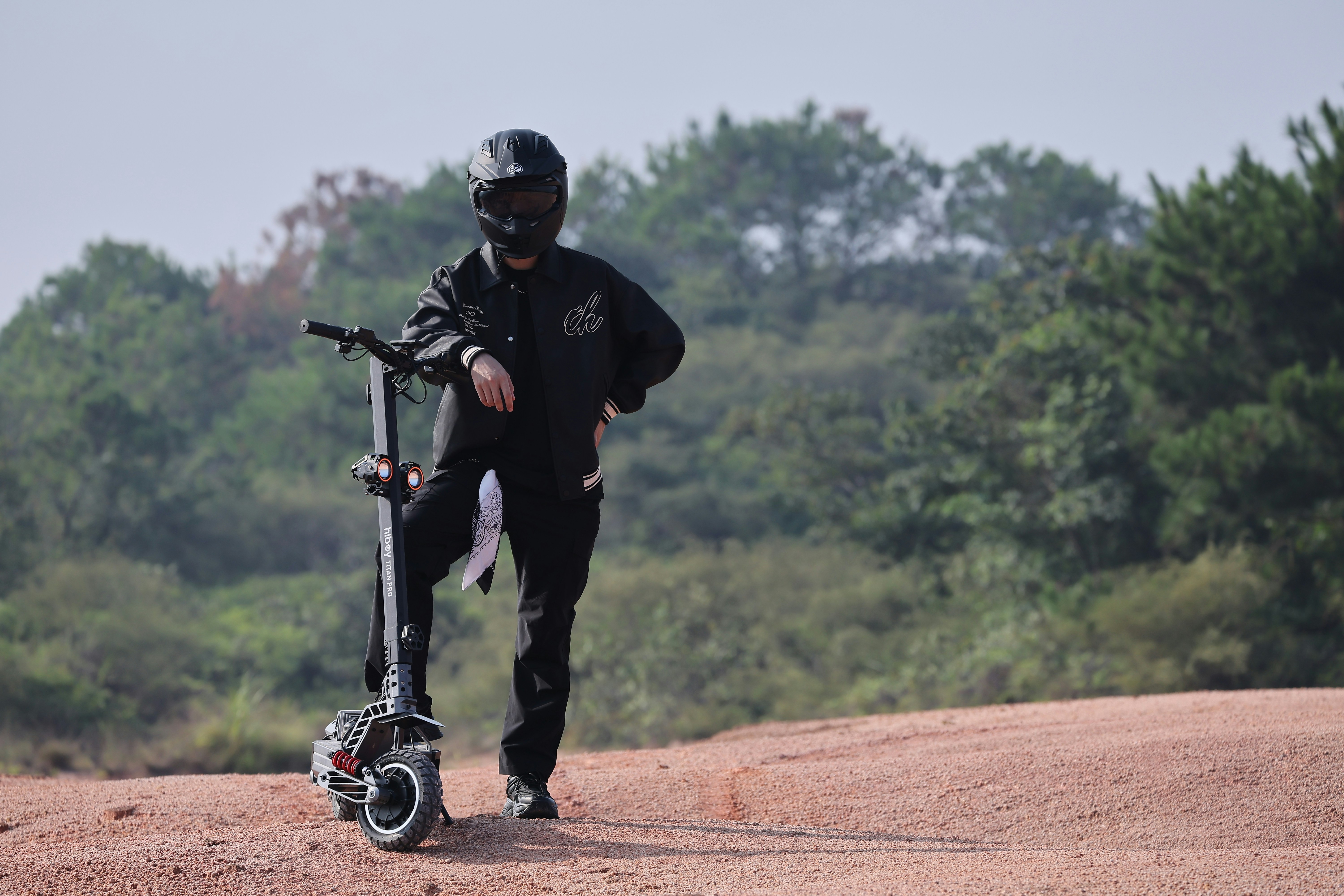 Hiboy TITAN PRO Electric Scooter 2025 | Person in helmet with scooter outdoors