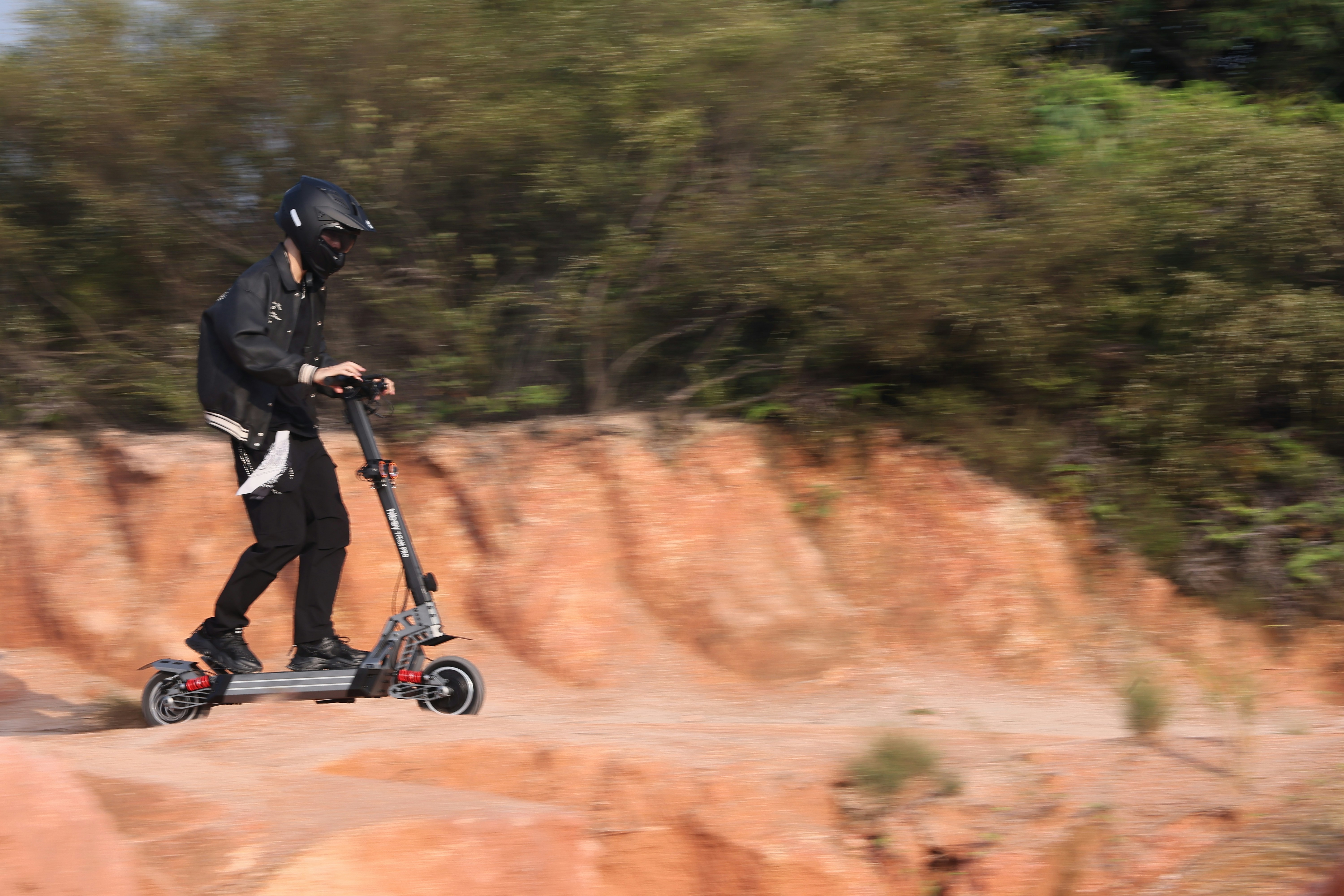 Rider in Motion: Alleycat on an Orange Ridge