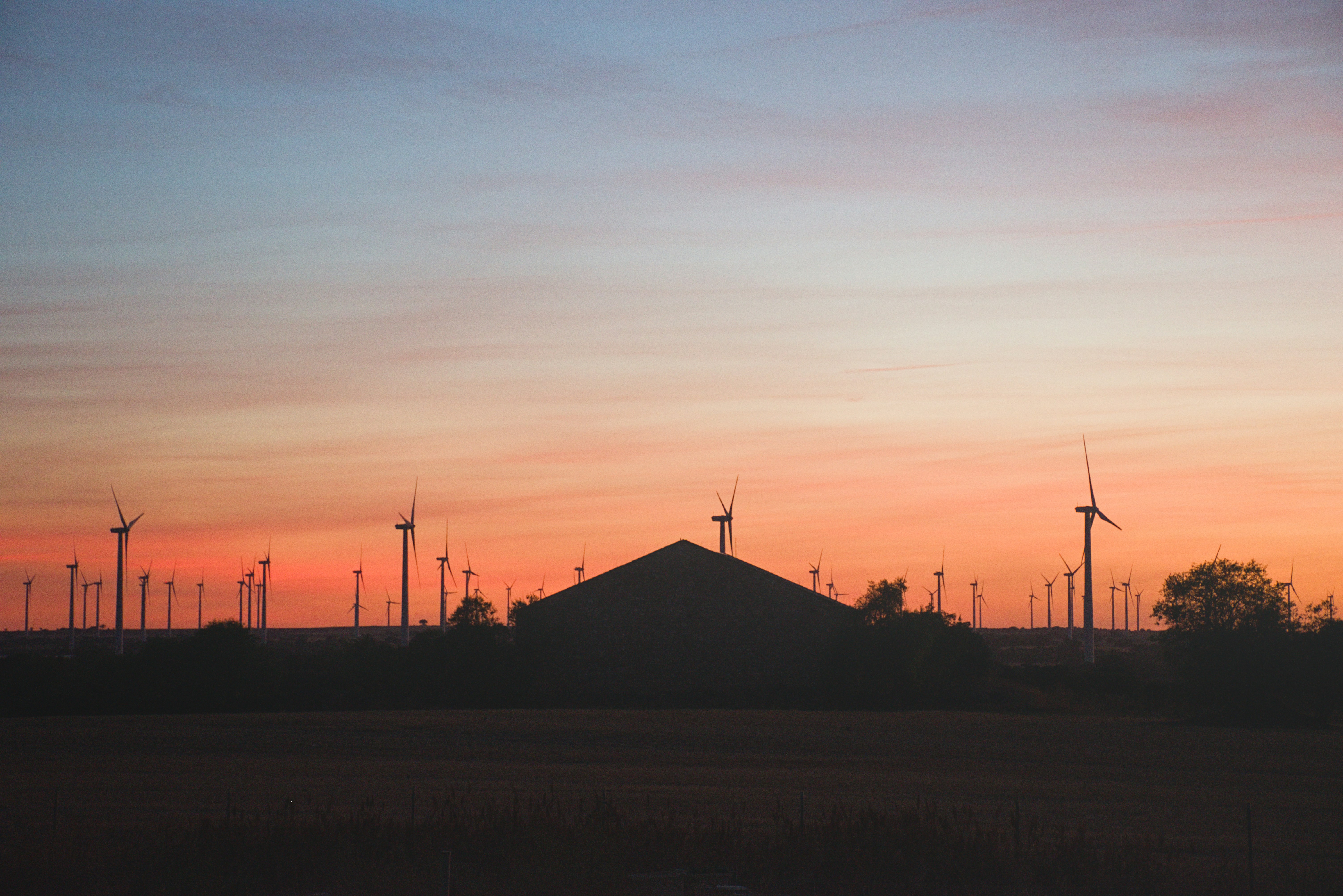 Silhouette Symphony: Wind and Sky at Dusk