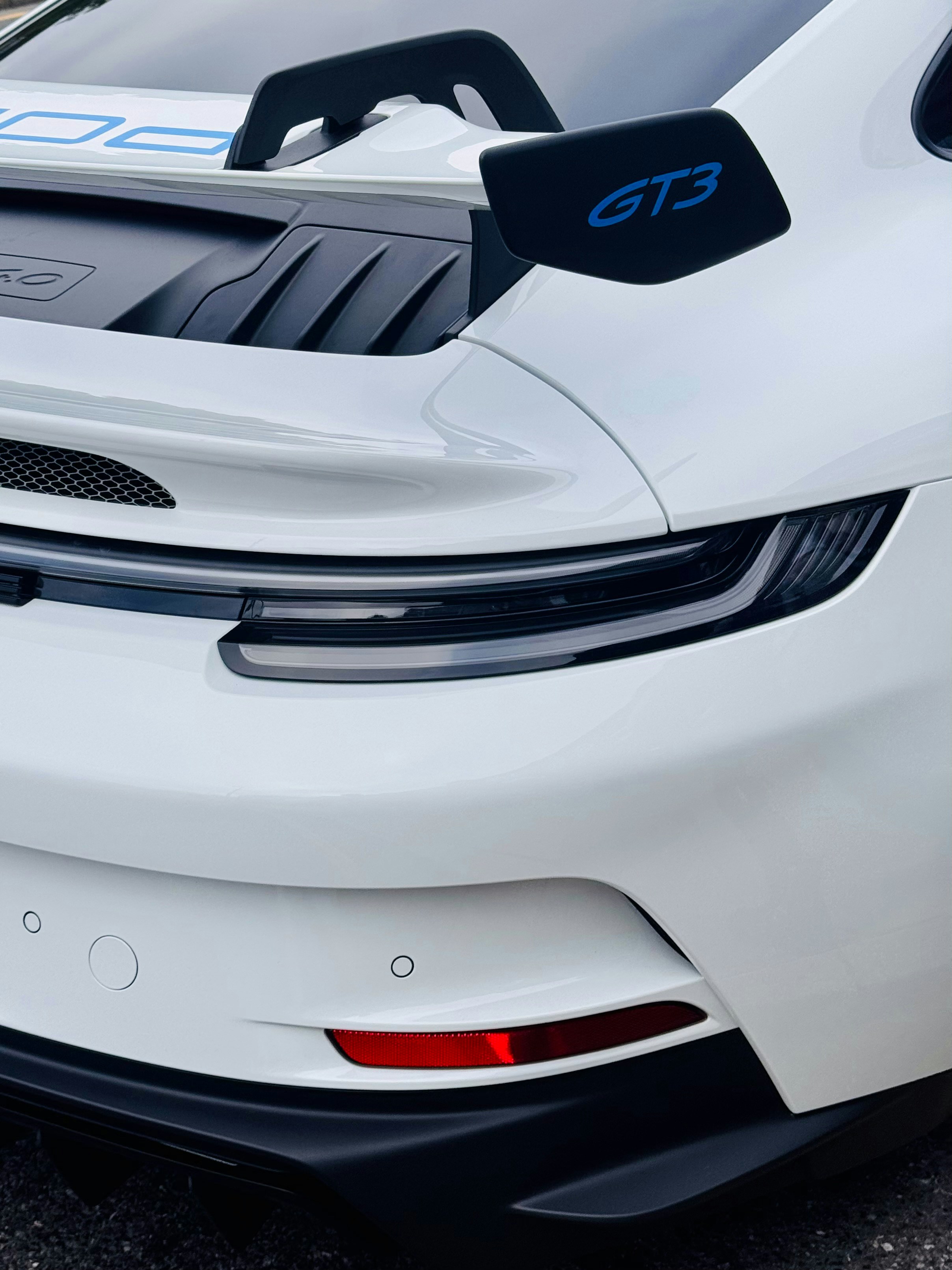 White GT3 Rear Wing in Focus: Porsche's Aerodynamic Precision