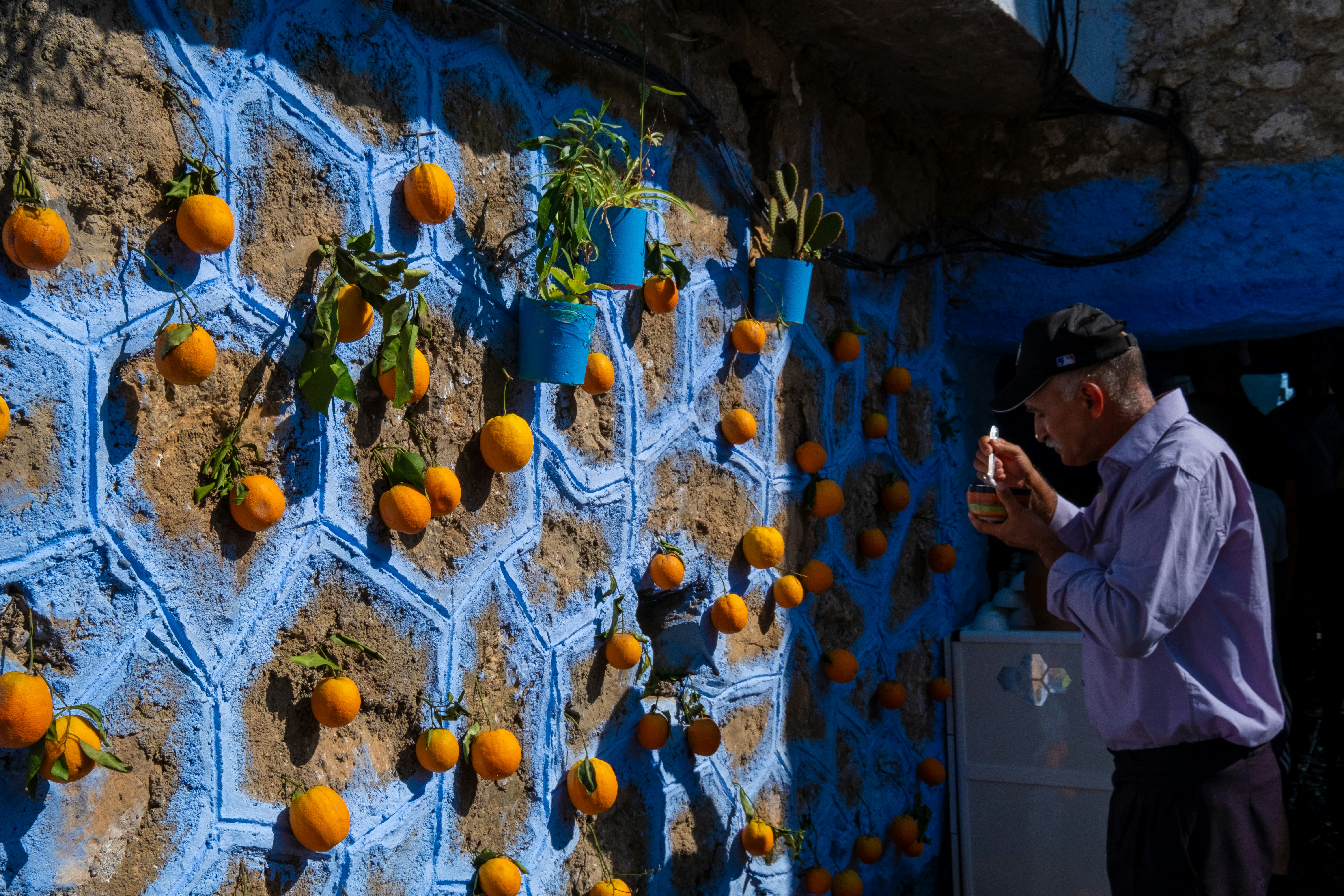 Citrus Harmony: A Man's Craft in Colorful Surroundings
