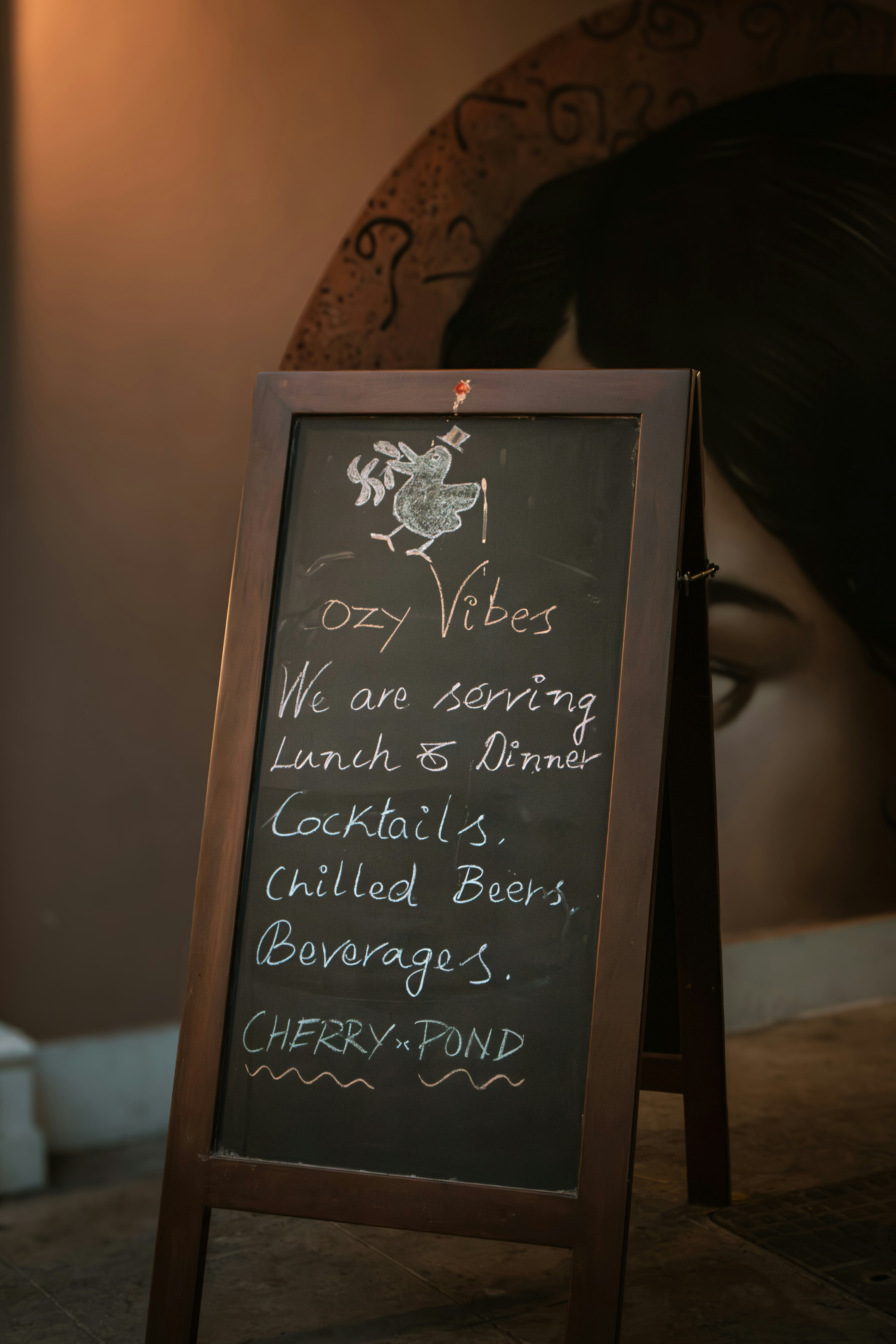 Chalkboard menu lists lunch, dinner, cocktails, beers, beverages.
