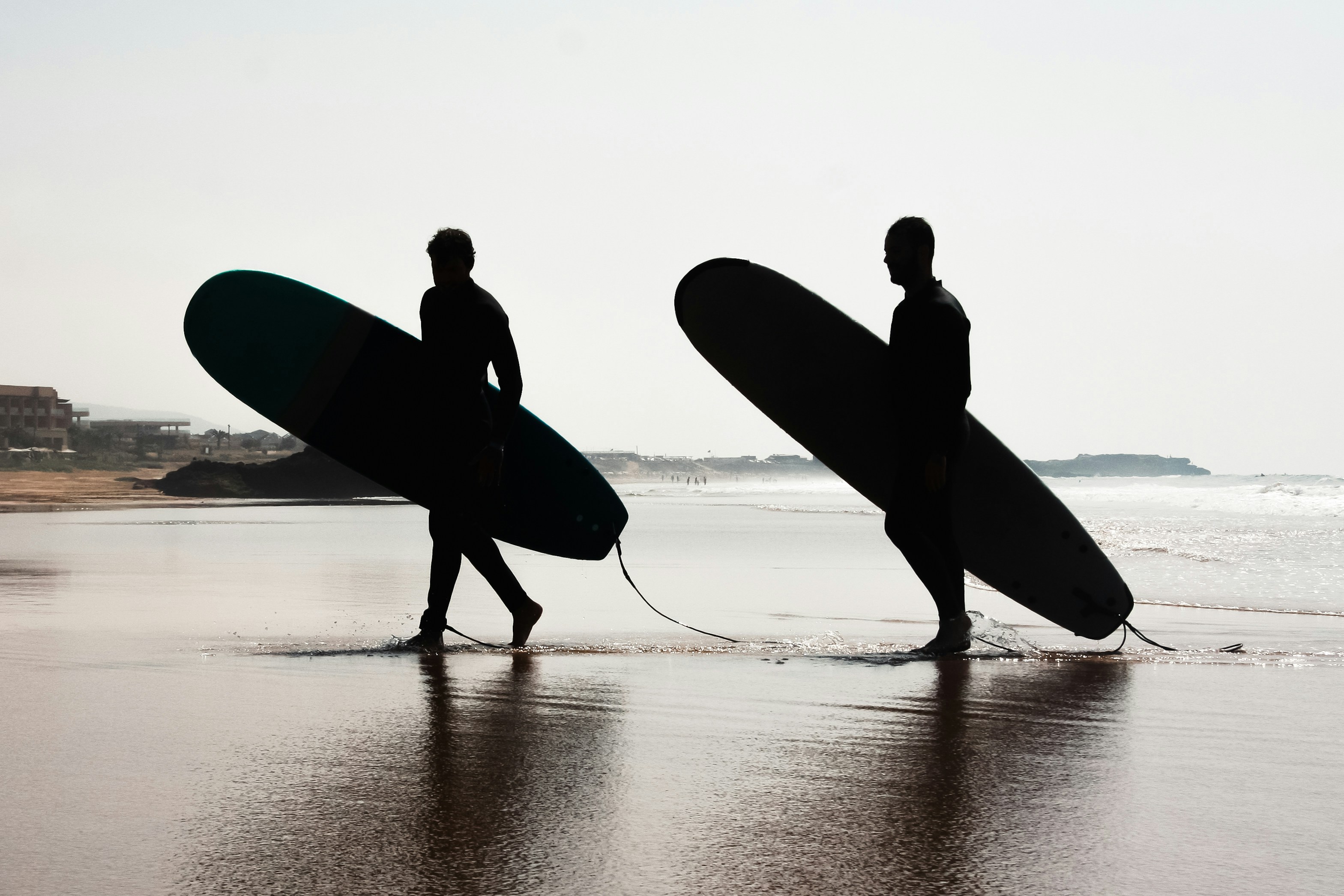 Silent Waves: Surfers in the Dusk