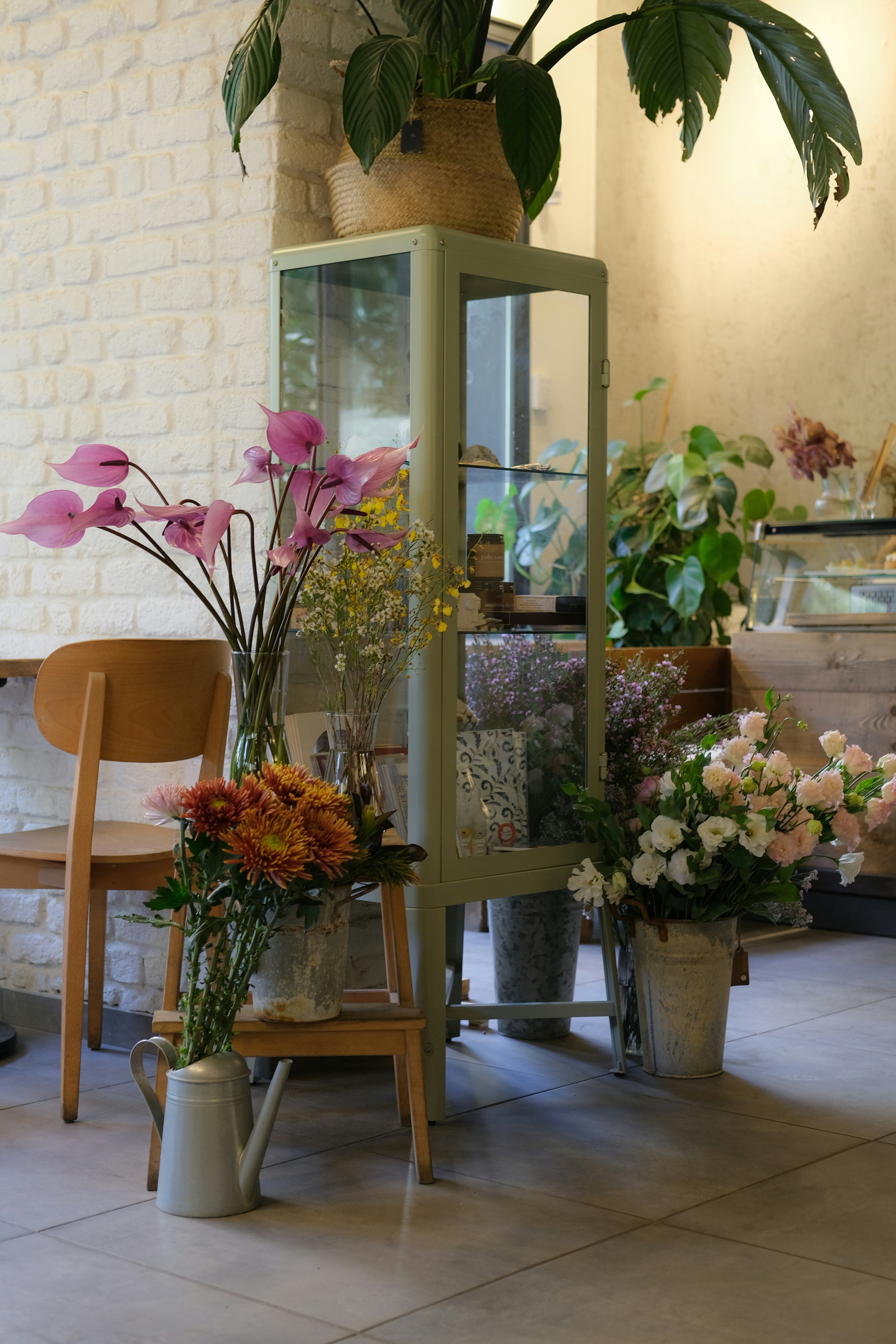 Assortment of flowers displayed in a room.
