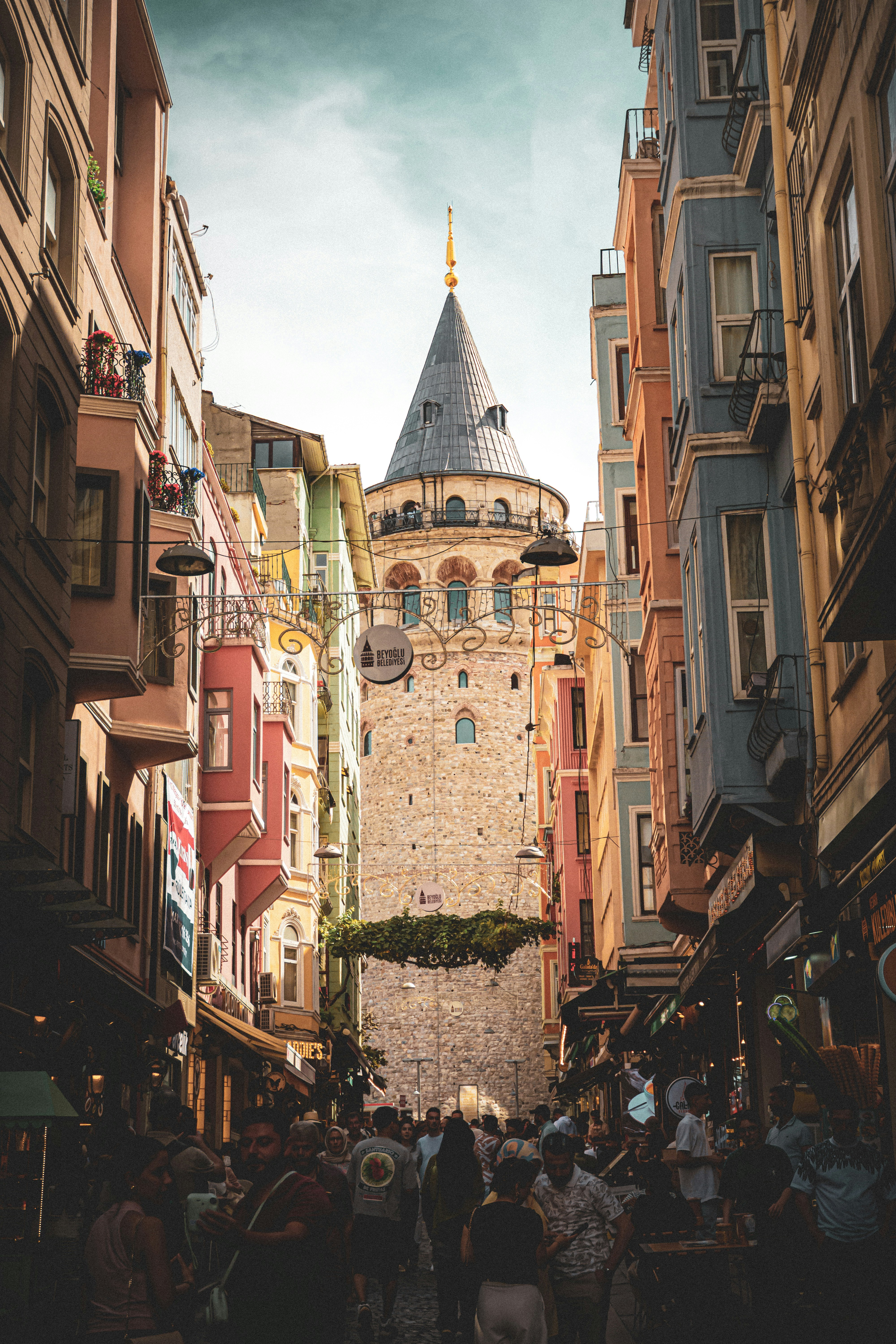 Tower^2 | Galata tower viewed from a bustling street.