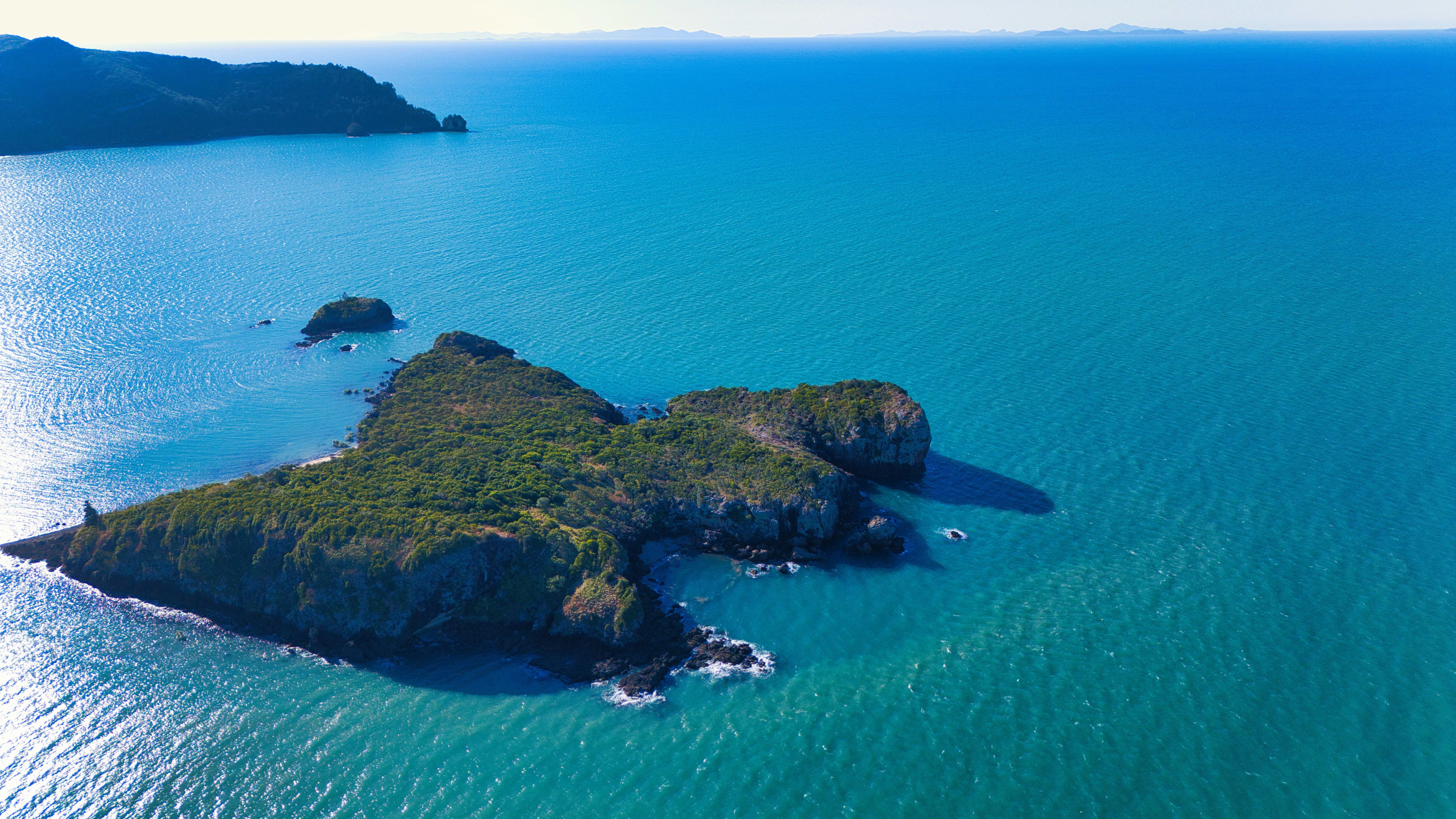 Emerald Outcrop Cradled by Pacific Turquoise