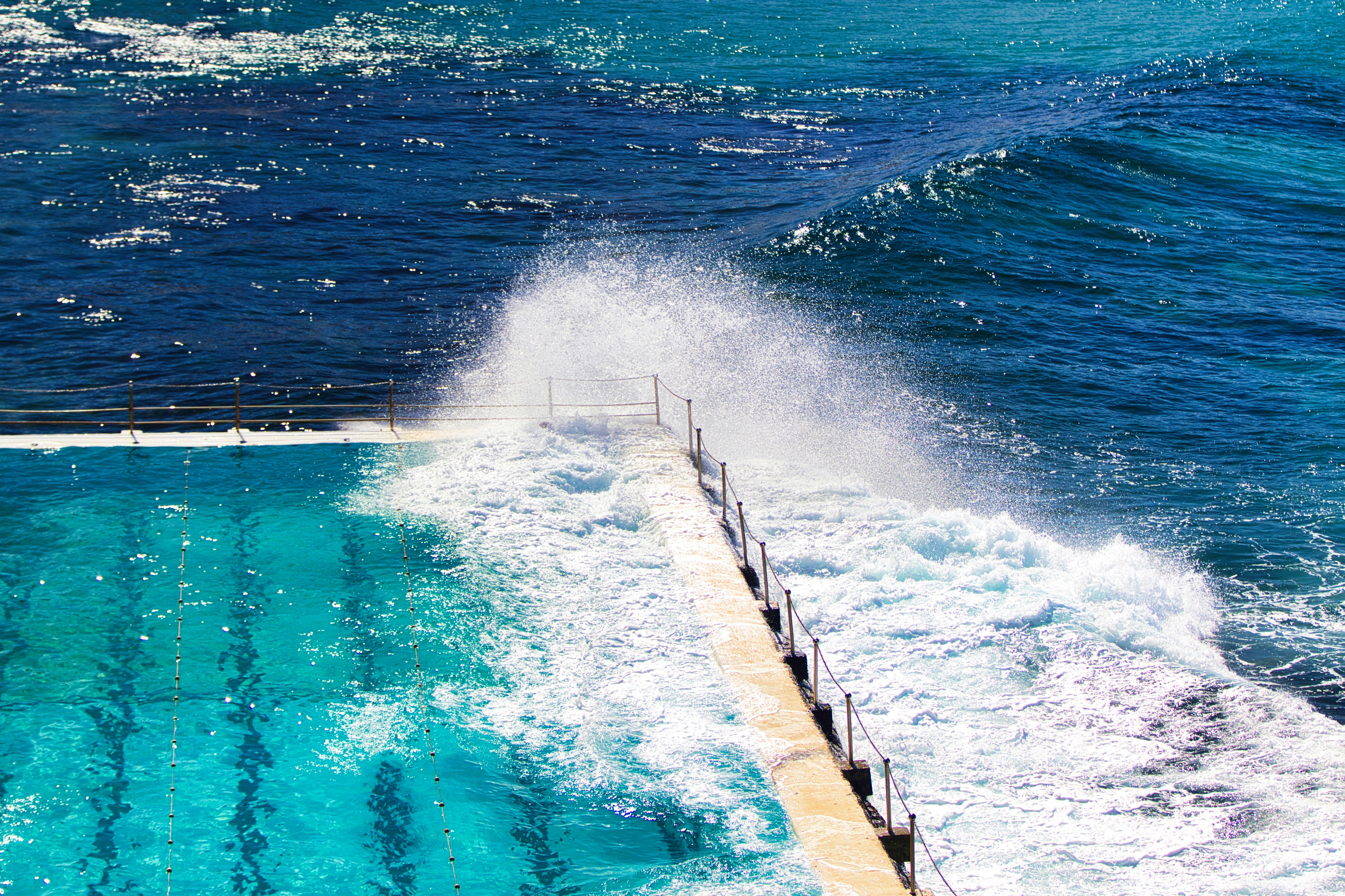 Waves crashing into an ocean swimming pool